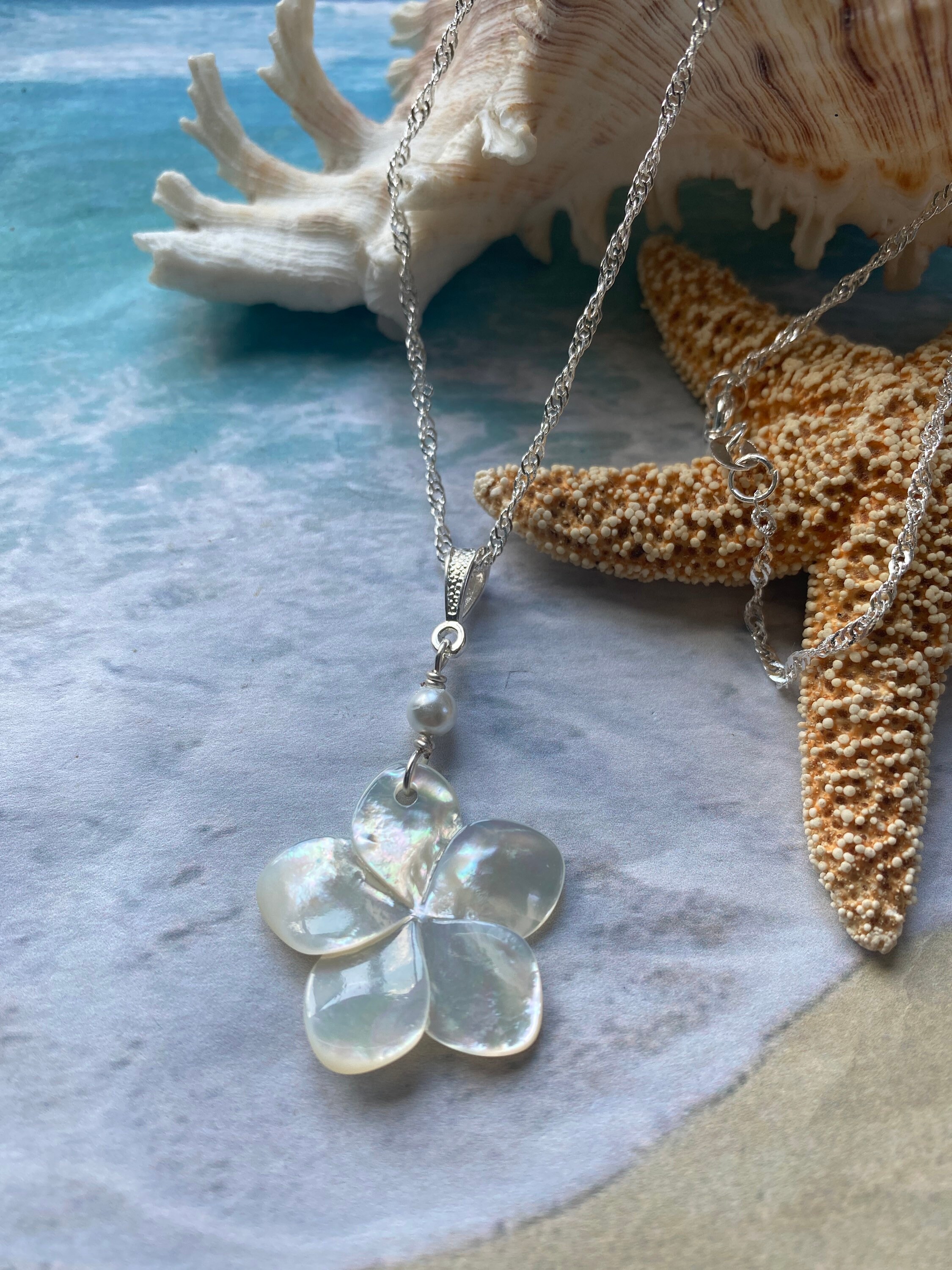 Mother of Pearl Aloha white laser cut plumeria with a pearl | Etsy