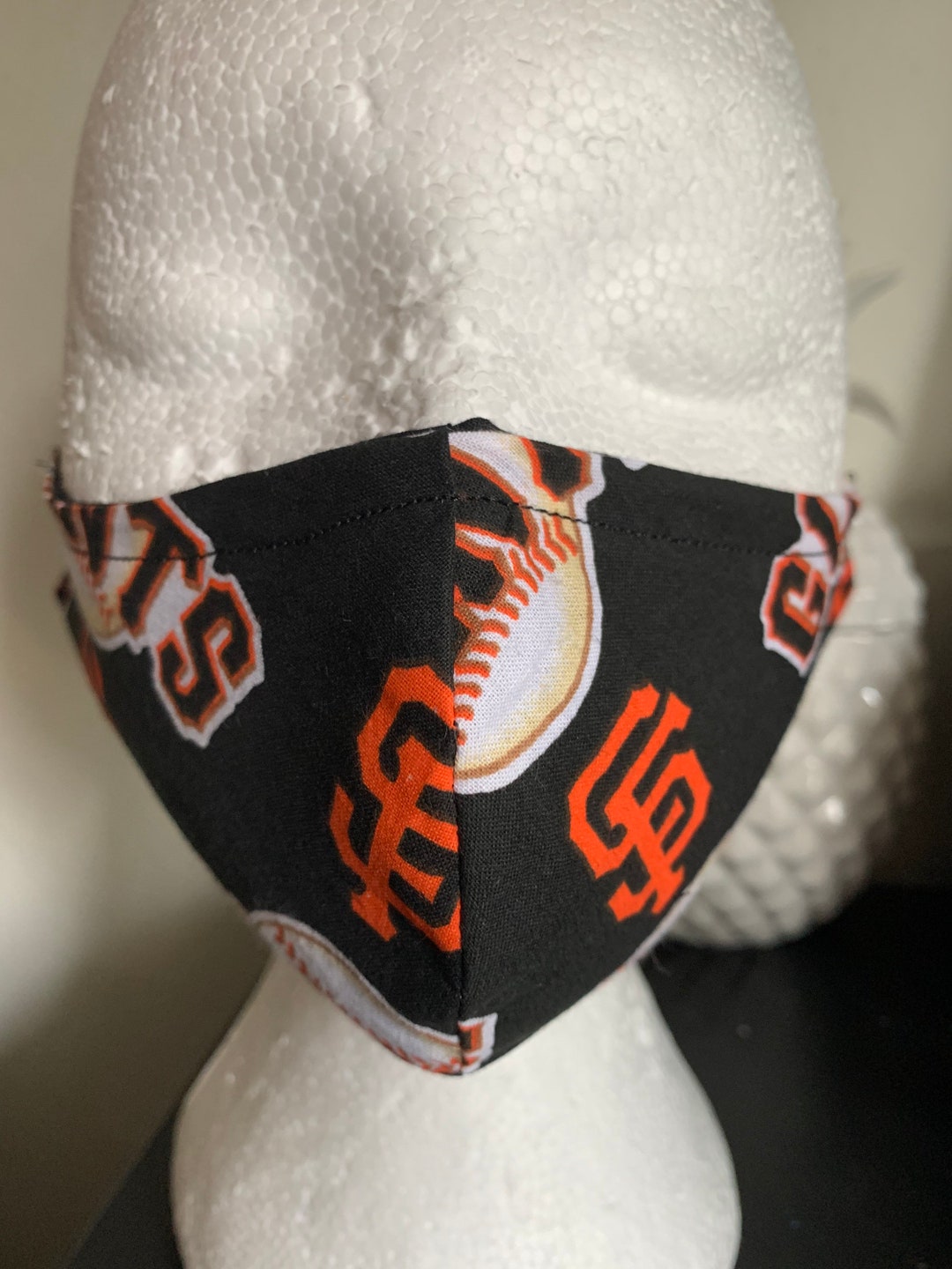 The San Francisco Giants Baseball With Black Reversible Face Mask ...