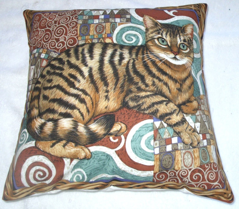 Tabby Cat Sitting on a Mosaic Patterned Rug in a Wicker Basket Cushion ...