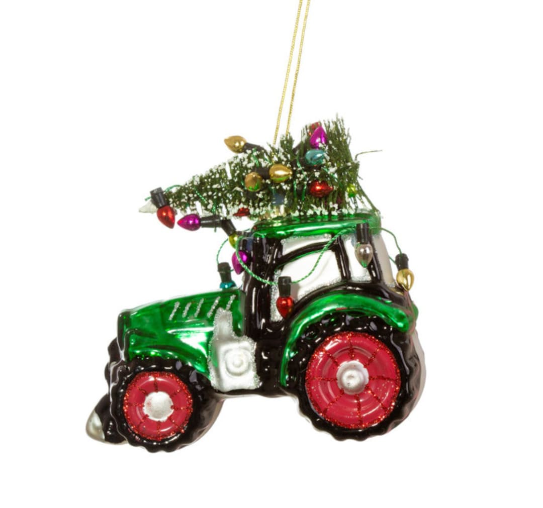 Green Tractor With Festive Lights Carrying Christmas Tree Hanging ...
