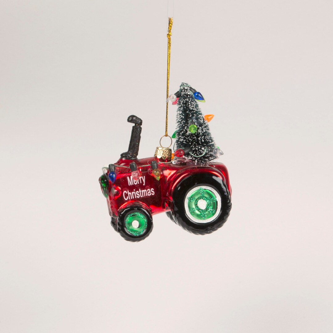 Red Tractor With Festive Lights Carrying Christmas Tree Hanging Bauble ...