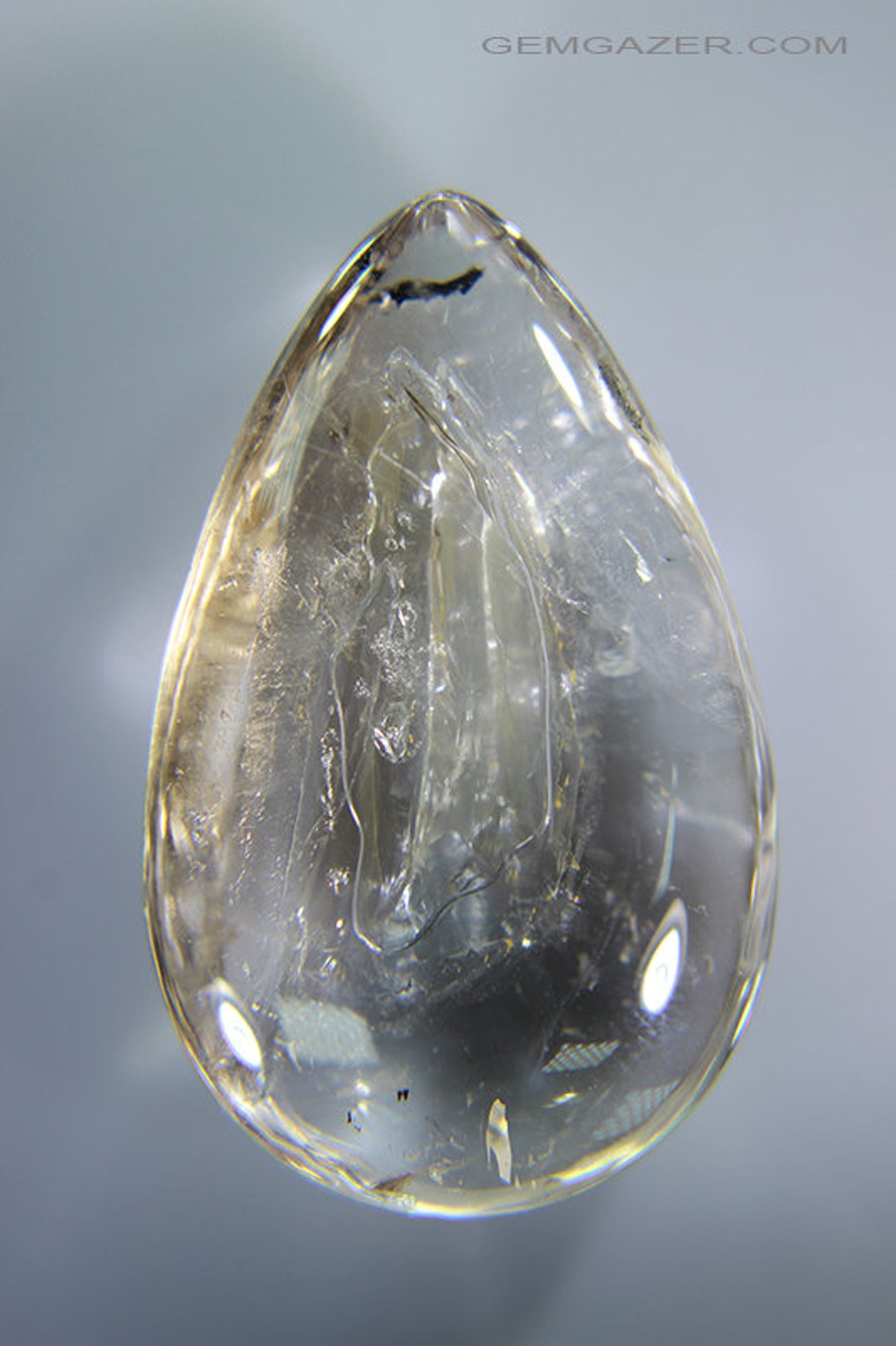 Quartz Cabochon With Negative Crystal Inclusions, Madagascar. 85.24 ...