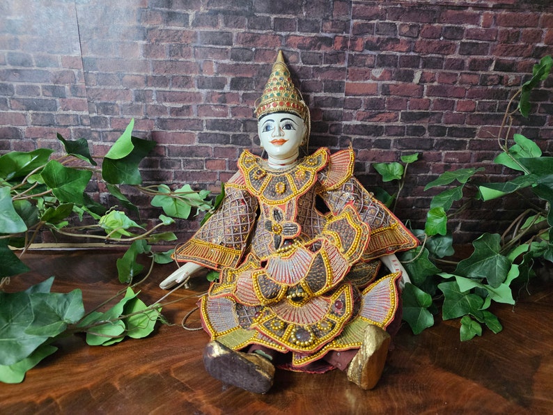 Older Asian Marionette in Traditional Head Dress and Beaded Outfit. in ...