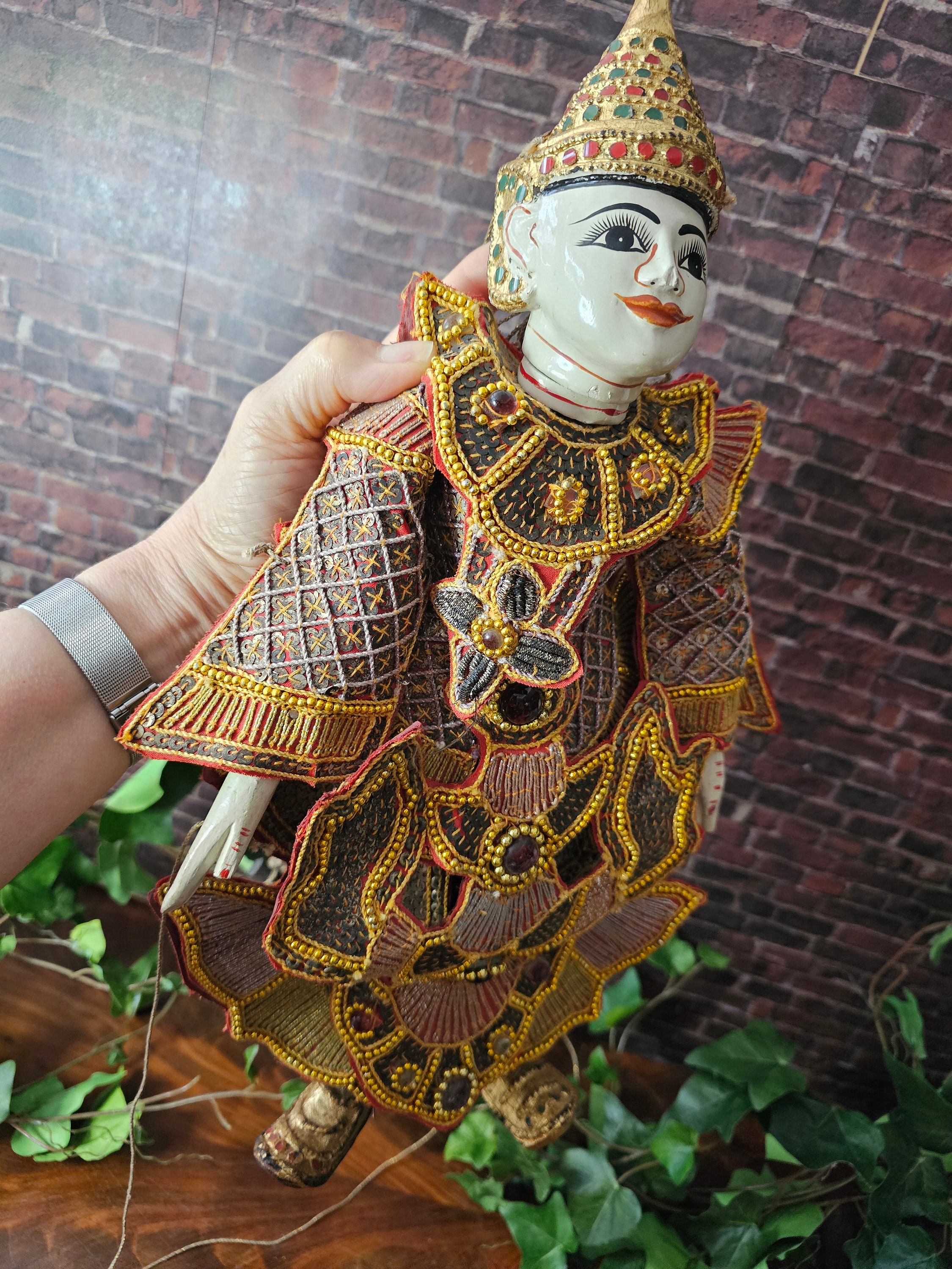 Older Asian Marionette in Traditional Head Dress and Beaded Outfit. in ...