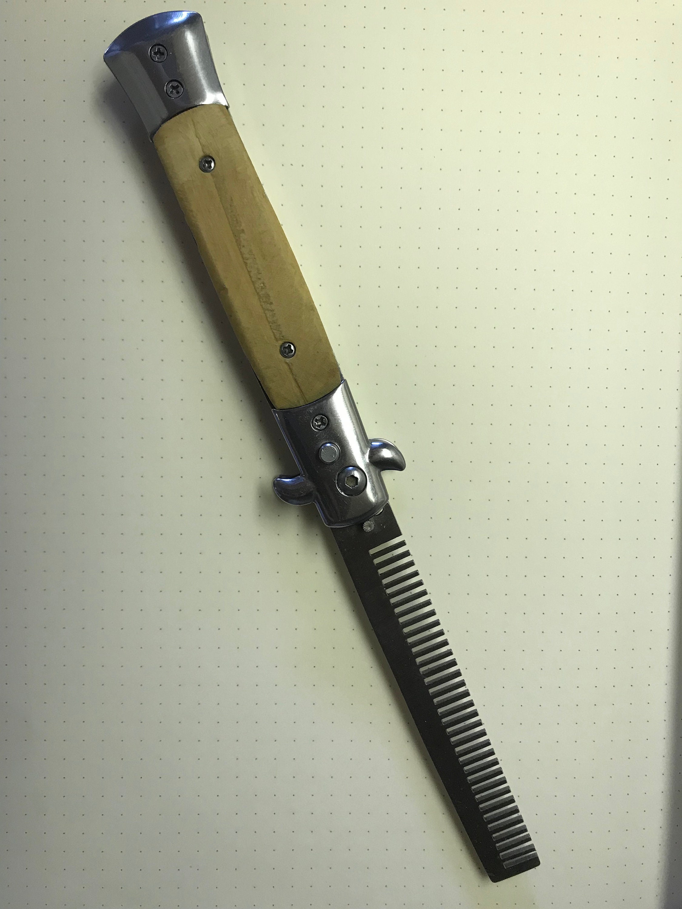 Switchblade Comb