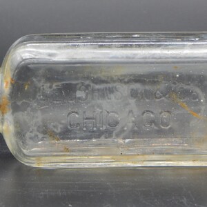 2 ANTIQUE JOHNSONS BOTTLES 1 Blue and 1 Clear Glass Medicine Bottle ...