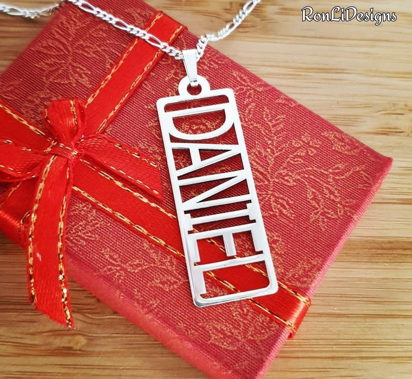 Daniel name necklace store