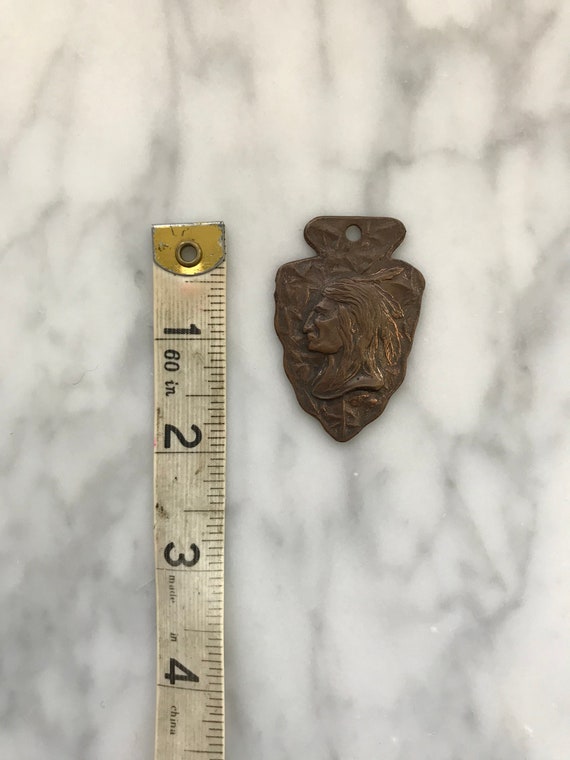 Antique brass pendant piece featuring First Nation's … - Gem