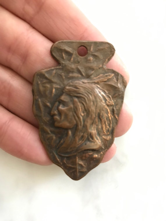 Antique brass pendant piece featuring First Nation's … - Gem