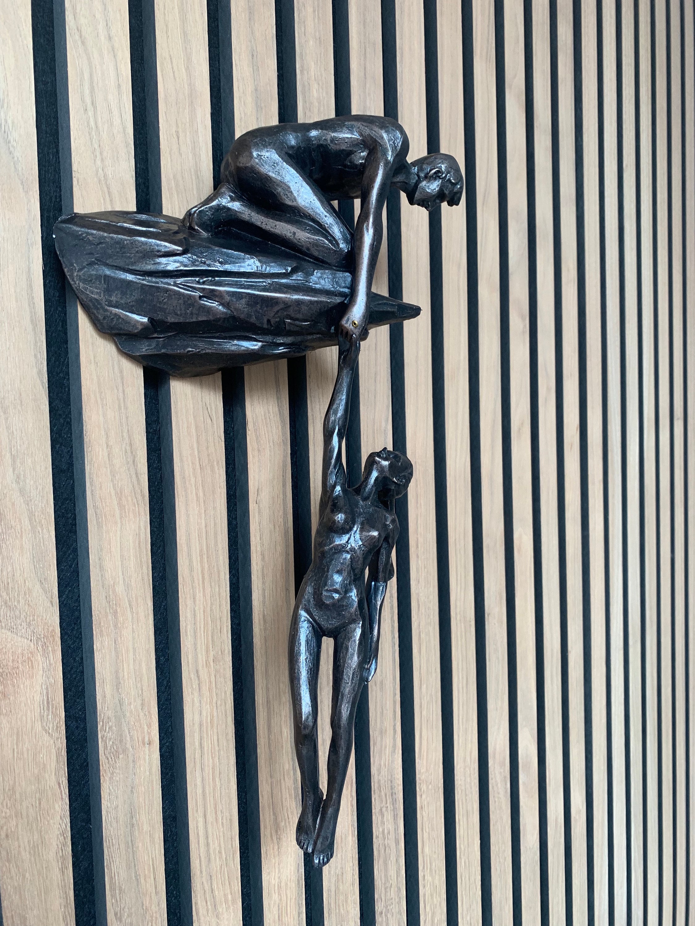 Man on Cliff Edge Holding a Hanging Woman Sculpture Wall Hanging Statue ...