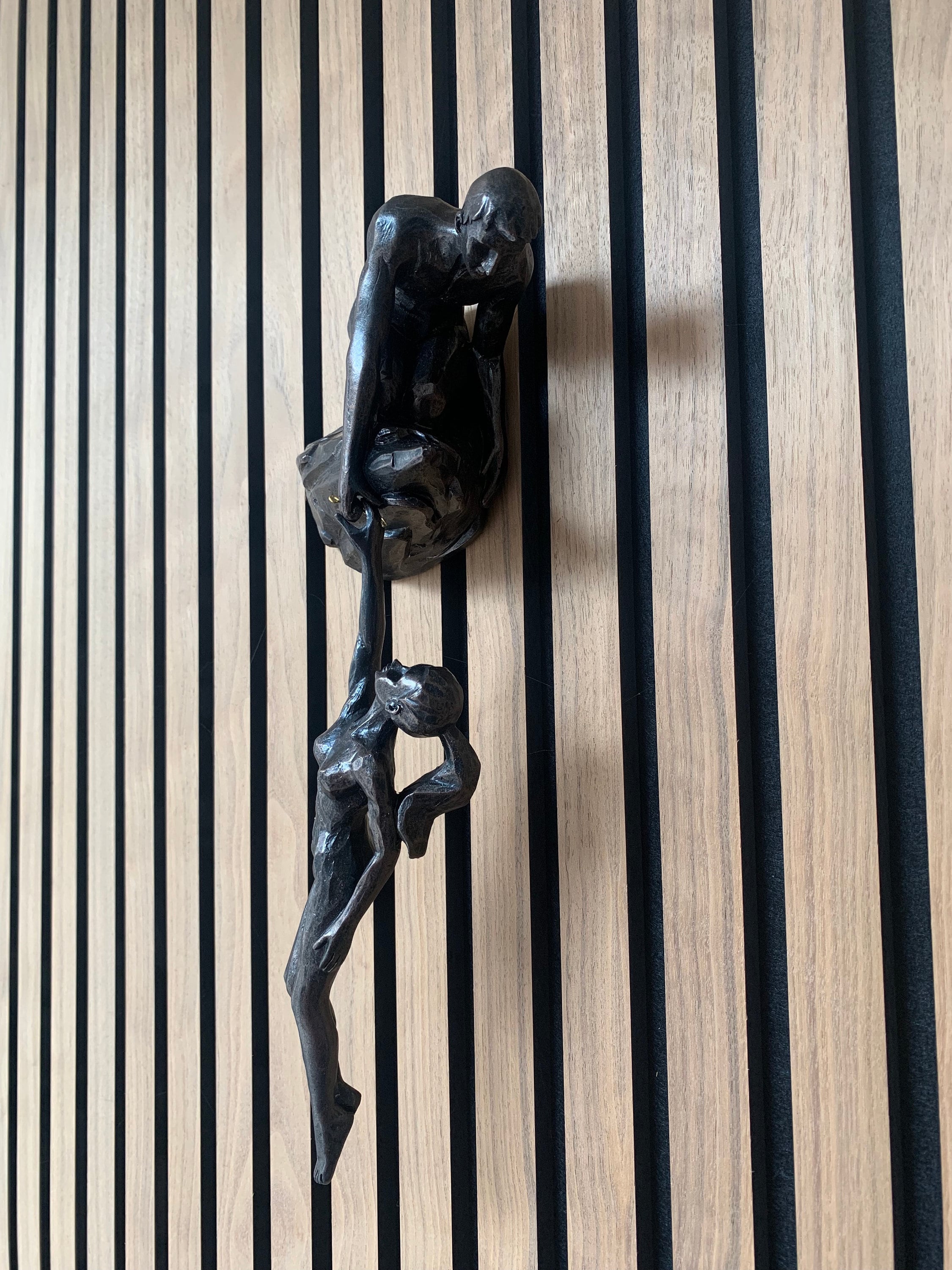 Man on Cliff Edge Holding a Hanging Woman Sculpture Wall Hanging Statue ...