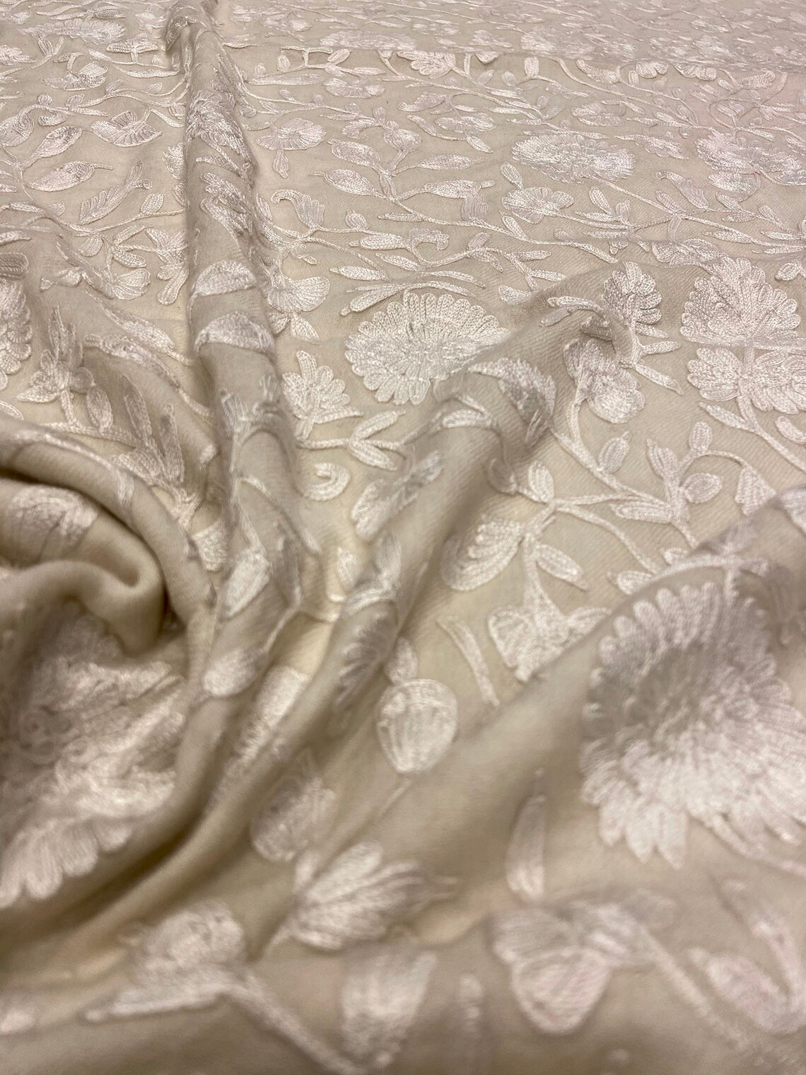 White Woollen Running Fabric With Self Floral Pattern Embroidery ...