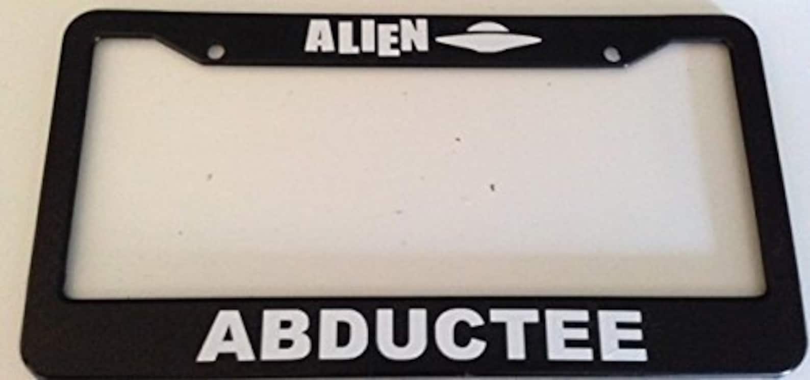 Alien UFO Abductee - Black Automobile License Plate Frame - Funny ...