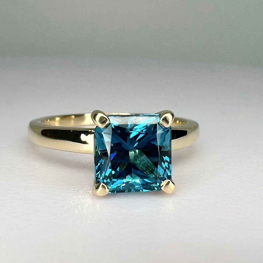 Blue Radiant Cut Solitaire Engagement Ring With Open U Setting, London ...