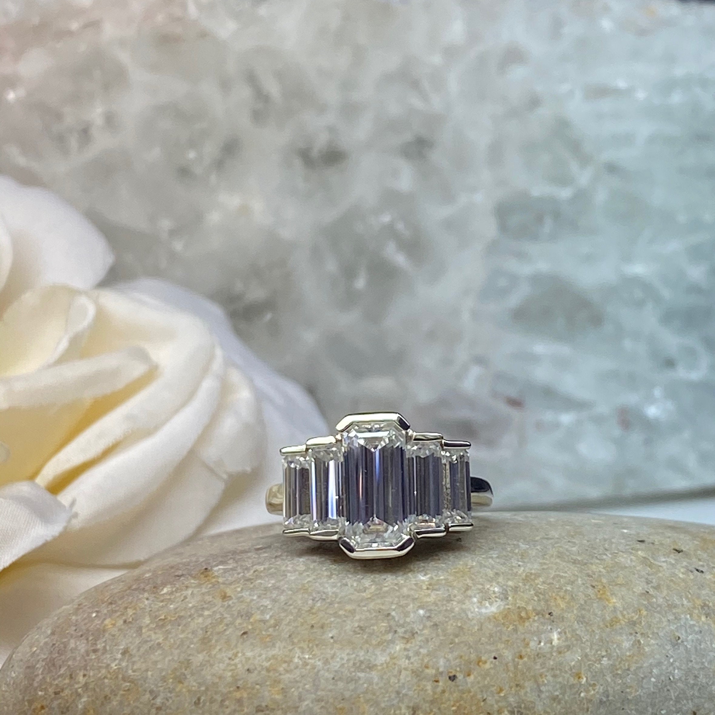 5 stone emerald cut diamond ring store