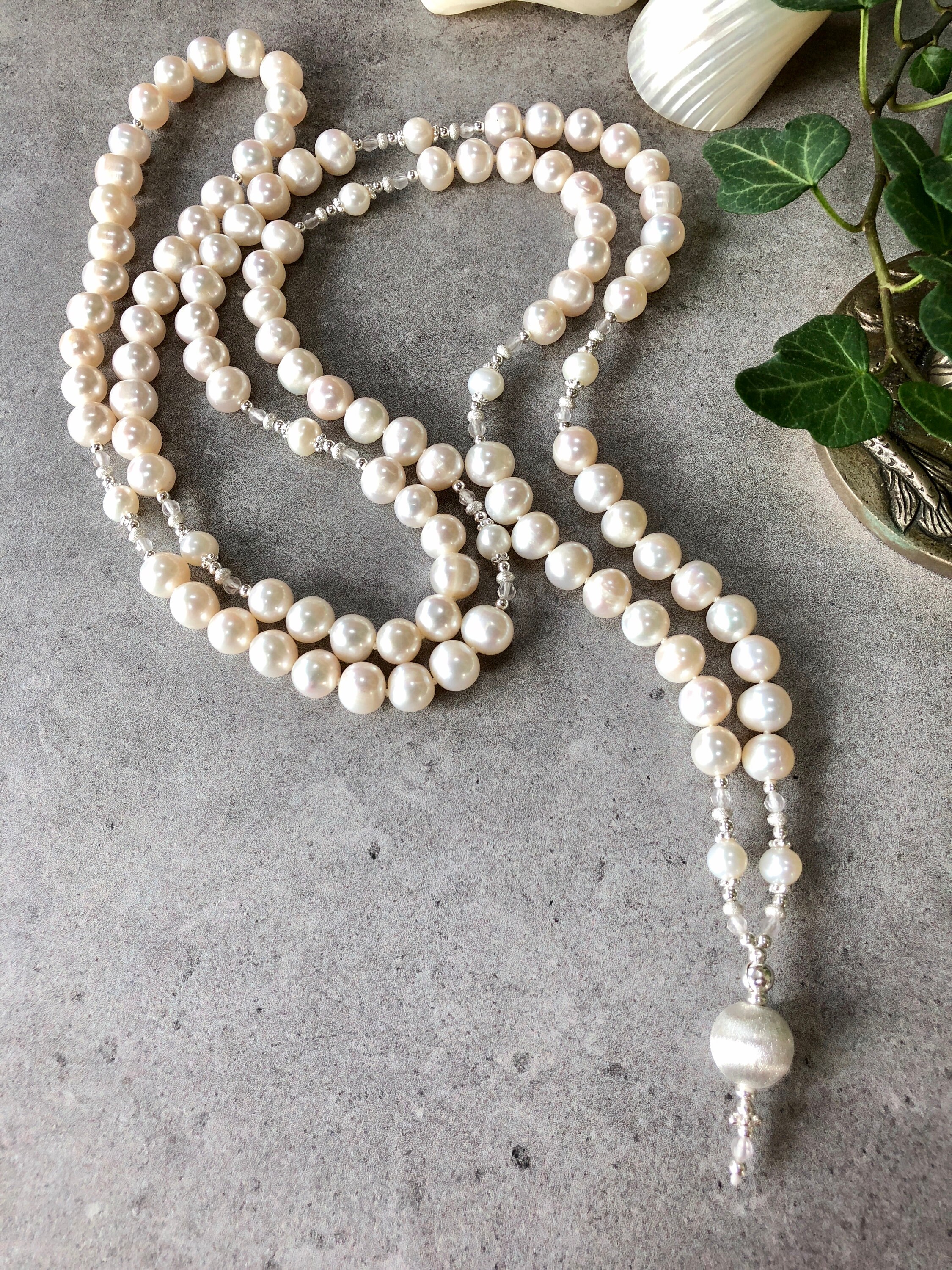 Long mala from 108 freshwater pearls decorated with silver (sterling)