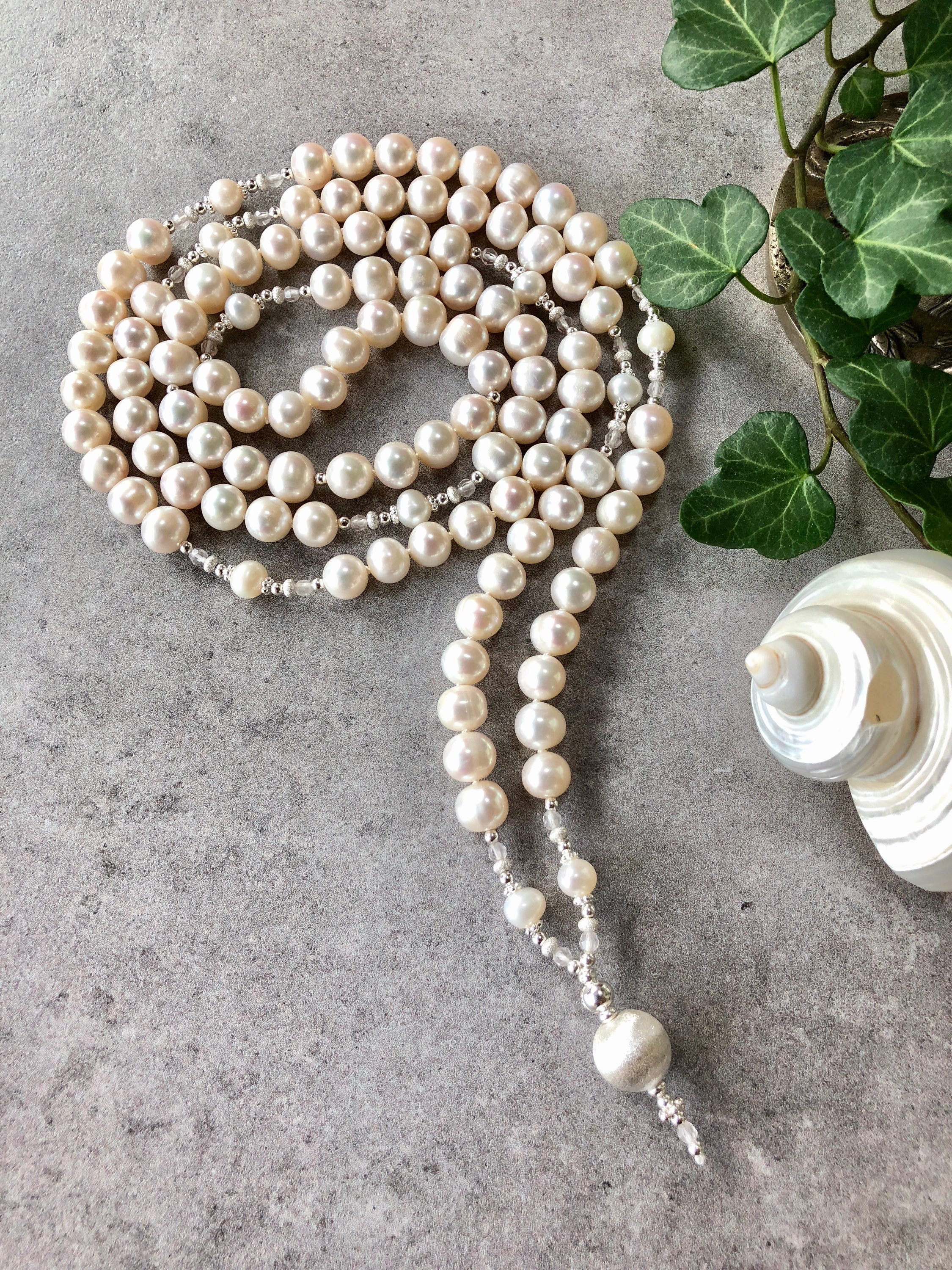 Long mala from 108 freshwater pearls decorated with silver (sterling)
