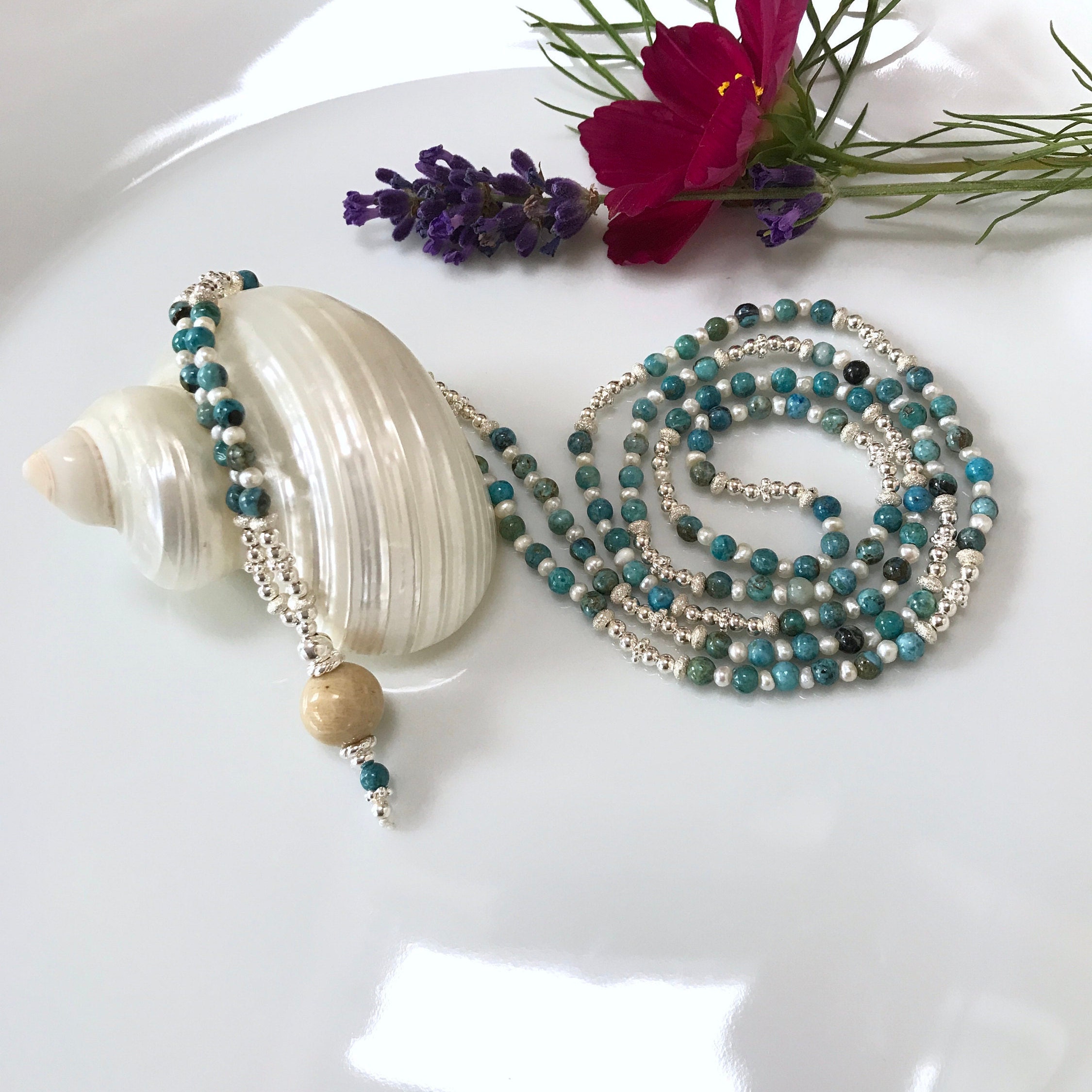 Petite mala made of opalith (blue), decorated with small freshwater ...