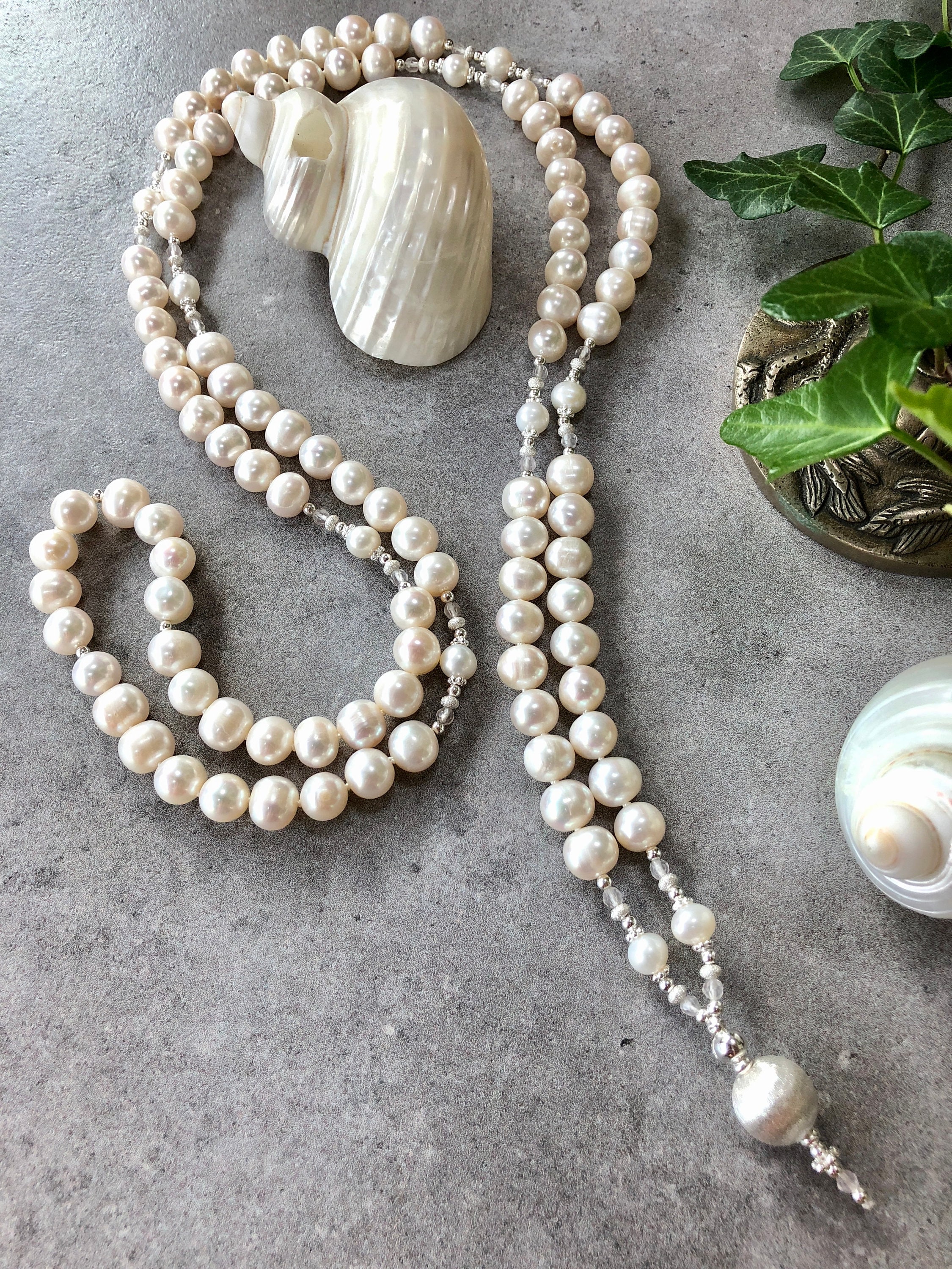 Long mala from 108 freshwater pearls decorated with silver (sterling)