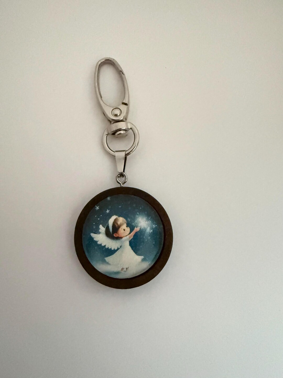 Cute Little Angel Catching a Snowflake Image on This Dark Brown Wood ...