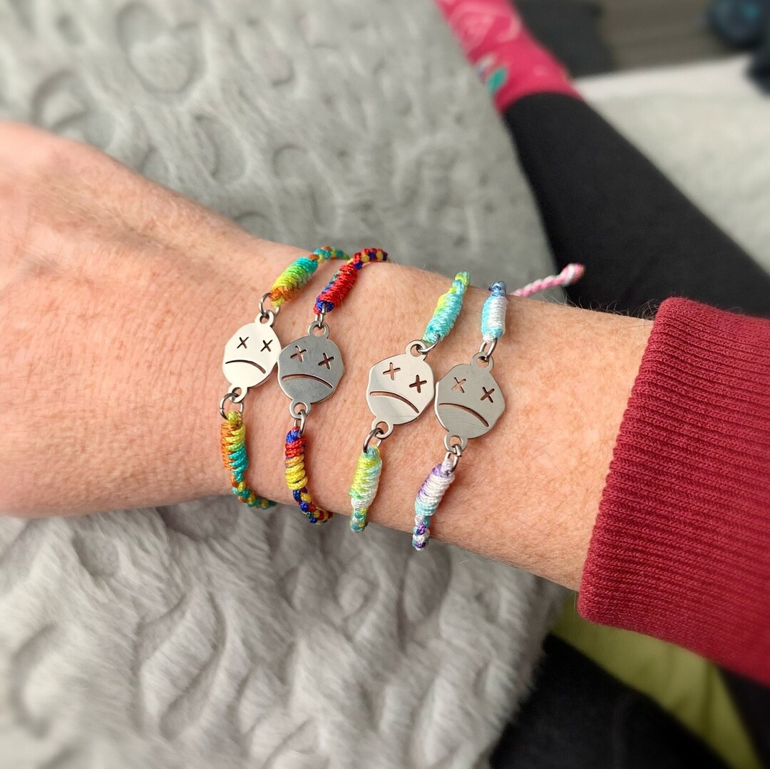 Adjustable Skull Bracelet With Sad Face Charm & Rainbow Colored Cord ...