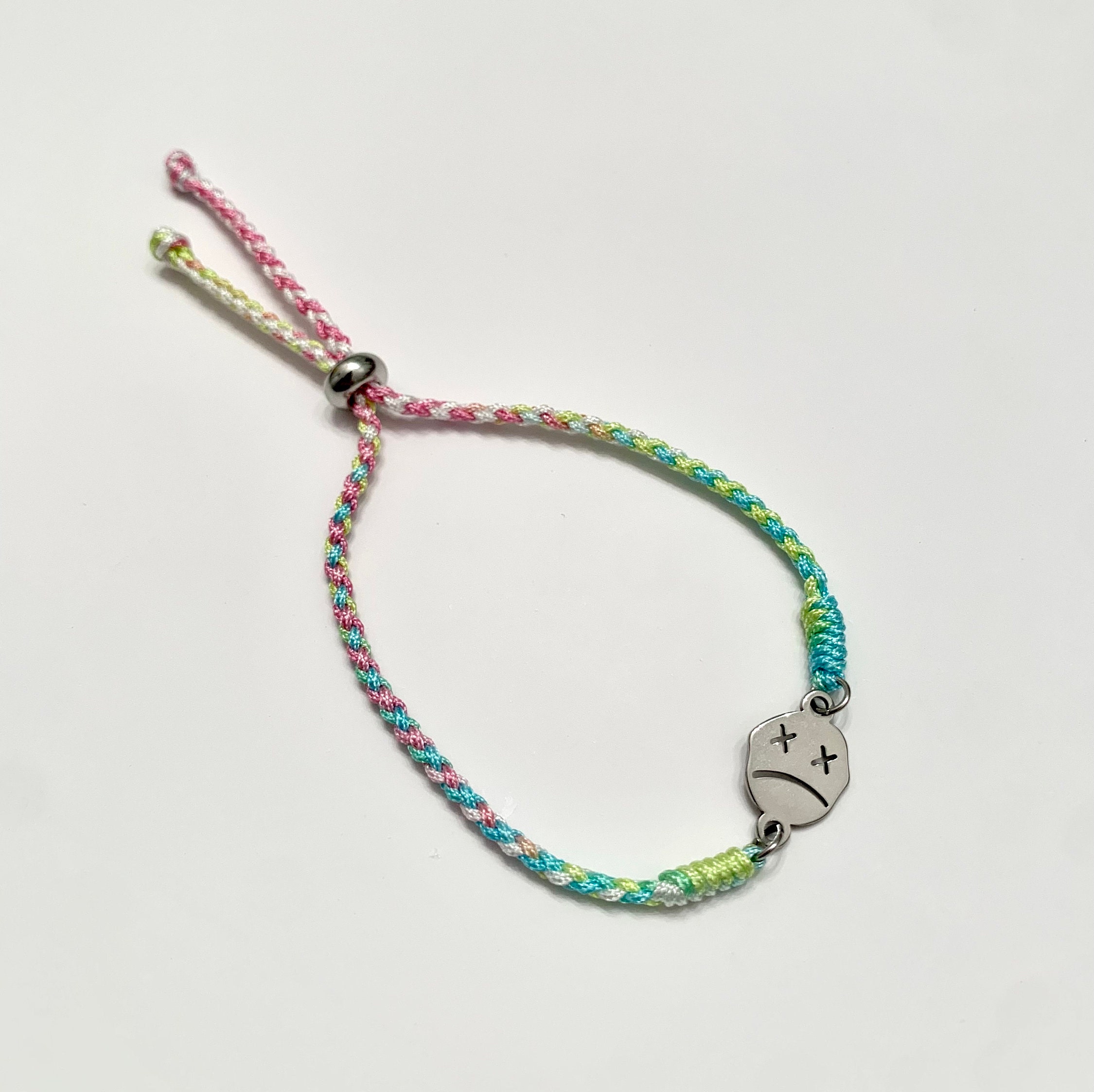 Adjustable Skull Bracelet With Sad Face Charm & Rainbow Colored Cord ...