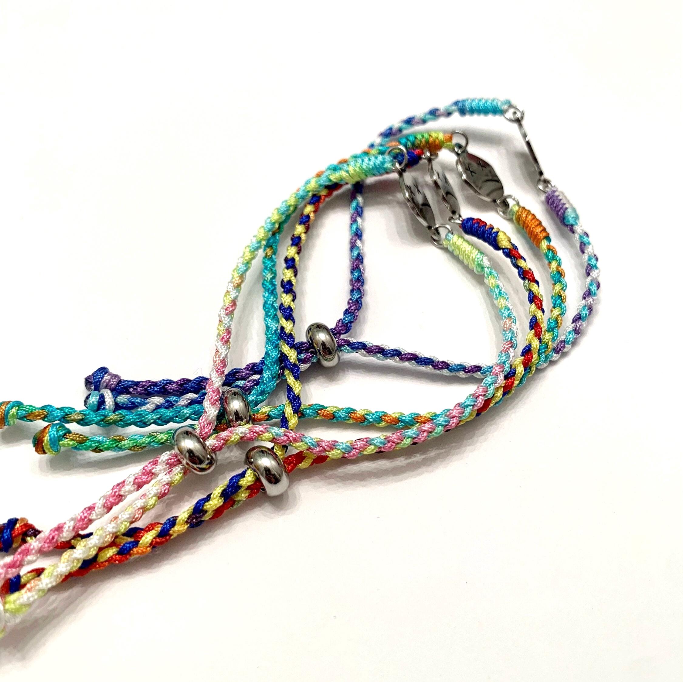 Adjustable Skull Bracelet With Sad Face Charm & Rainbow Colored Cord ...