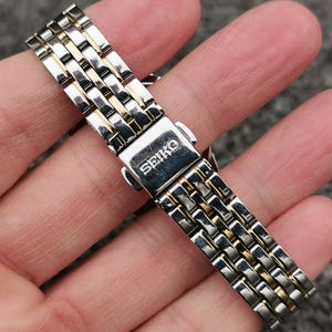 Seiko Quartz Watch, Crystal Bezel, Round Dial, Two-tone Stainless Steel ...