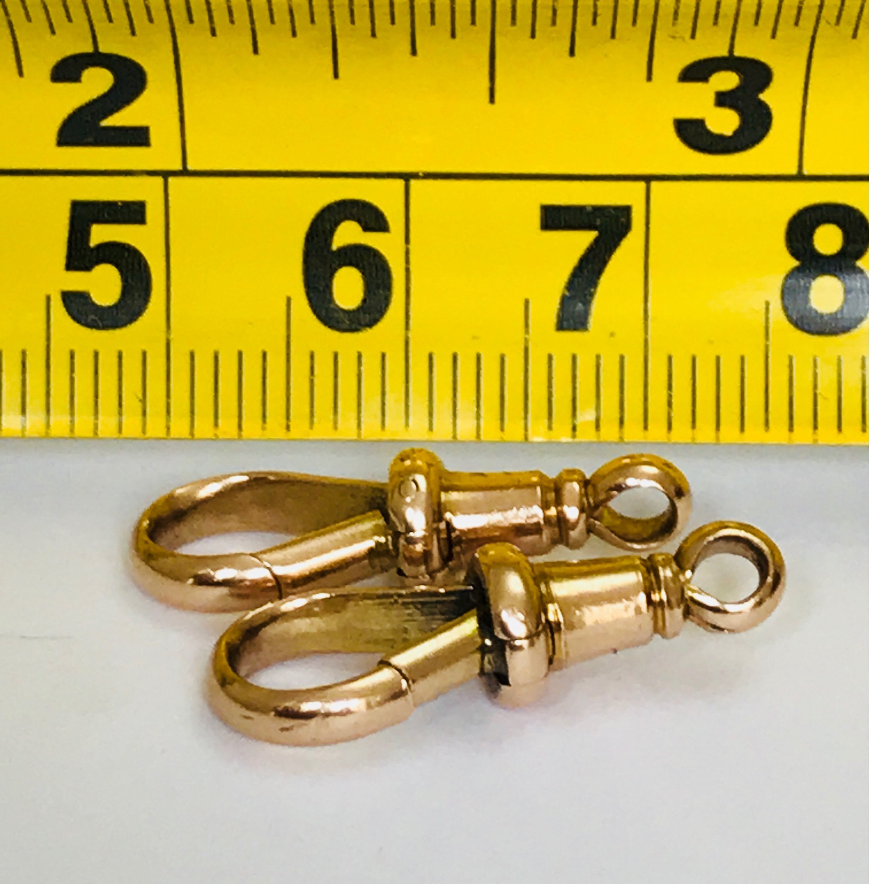 Superb matching pair of antique 9ct rose gold dog clips