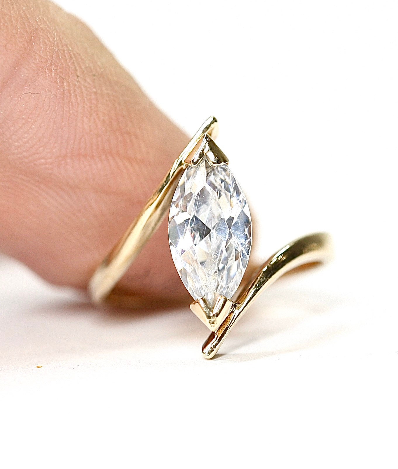 Sparkling vintage 9ct gold crossover ring with Marquise cut Cubic ...