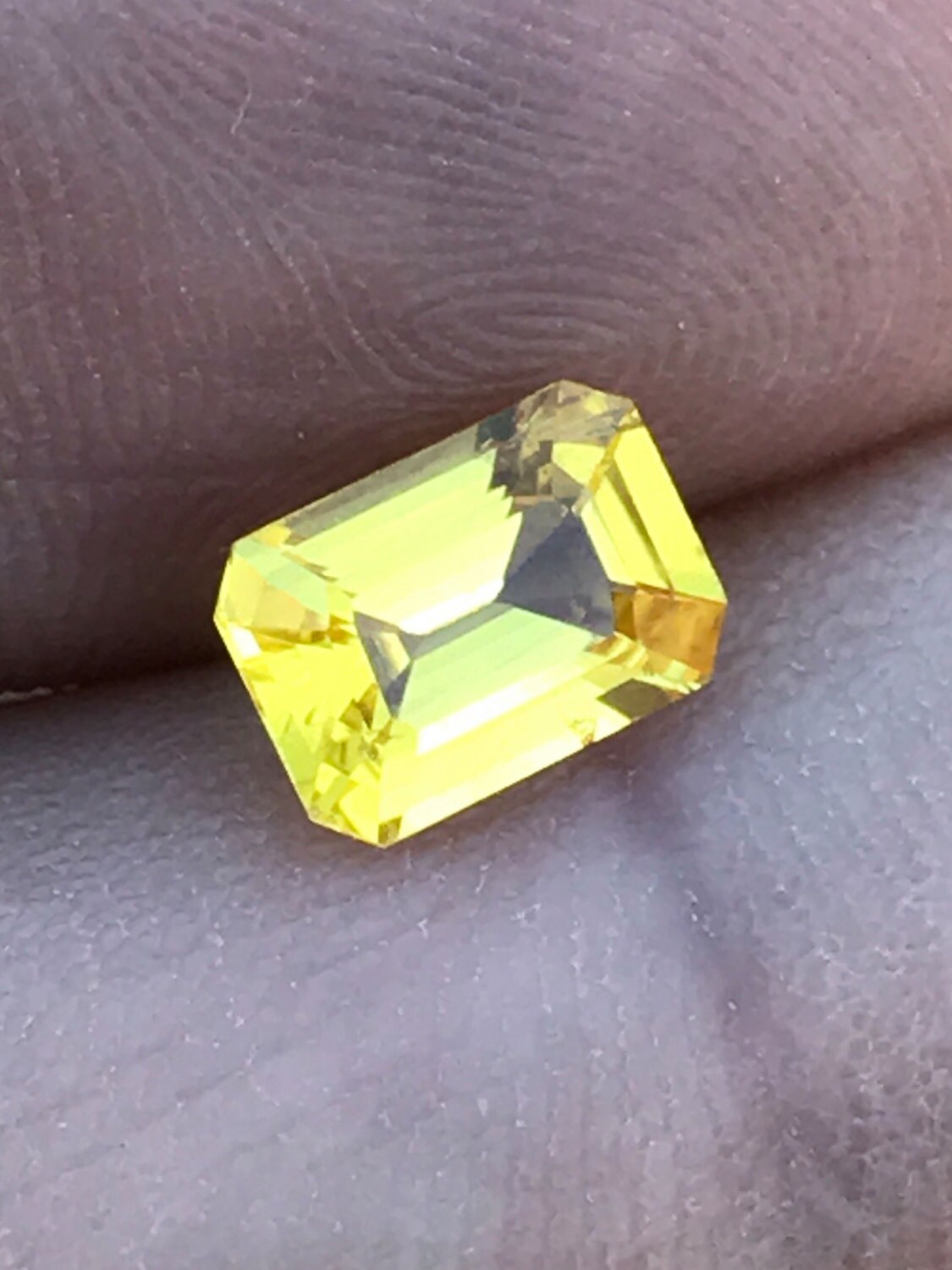 Vivid Ceylon Yellow Sapphire. Over one carat. Emerald cut!