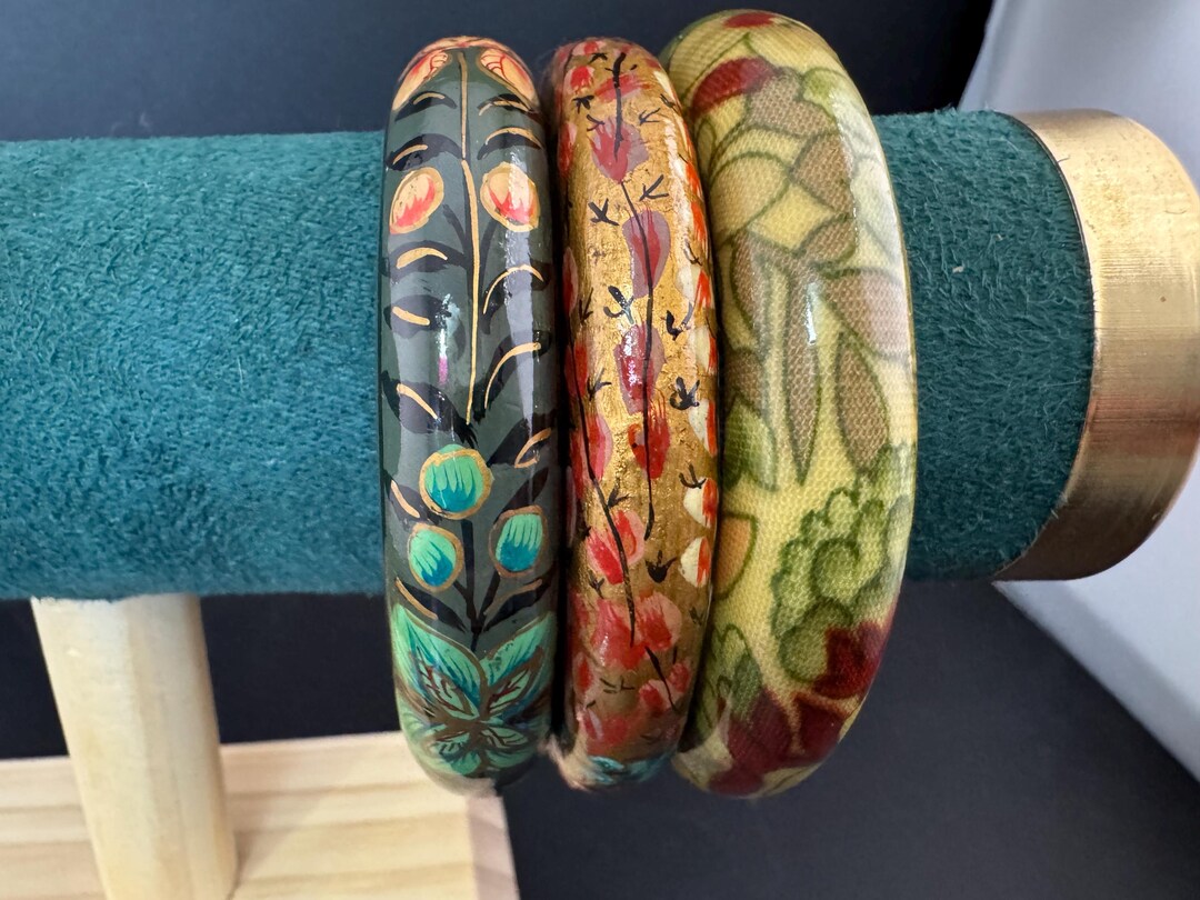 A Curated Set of 3 Green Gold Toned Wood or Paper Mache Wide Cuff ...