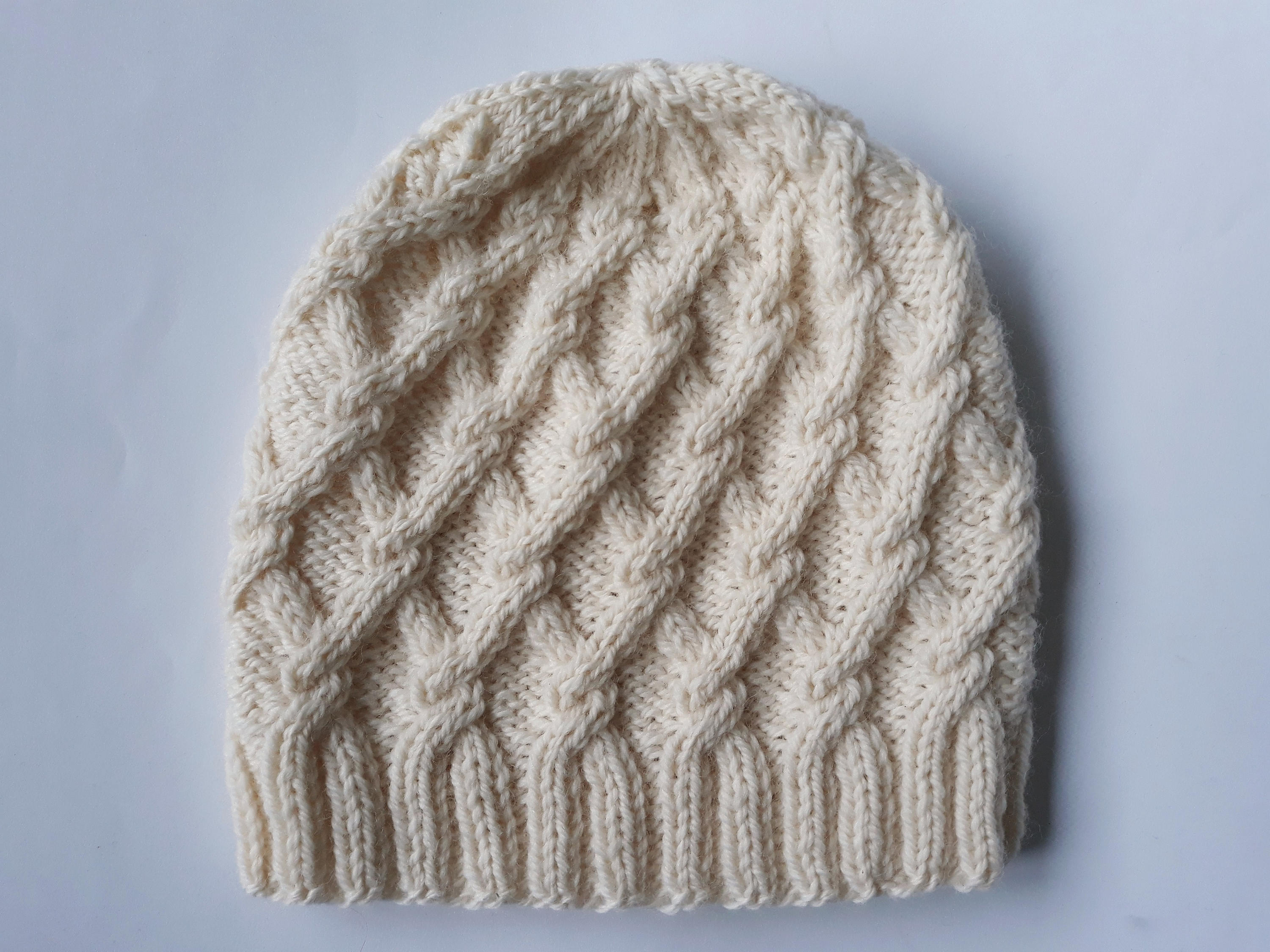 Cable knit beanie: Aran cable hat in traditional cream colour. Wool ...