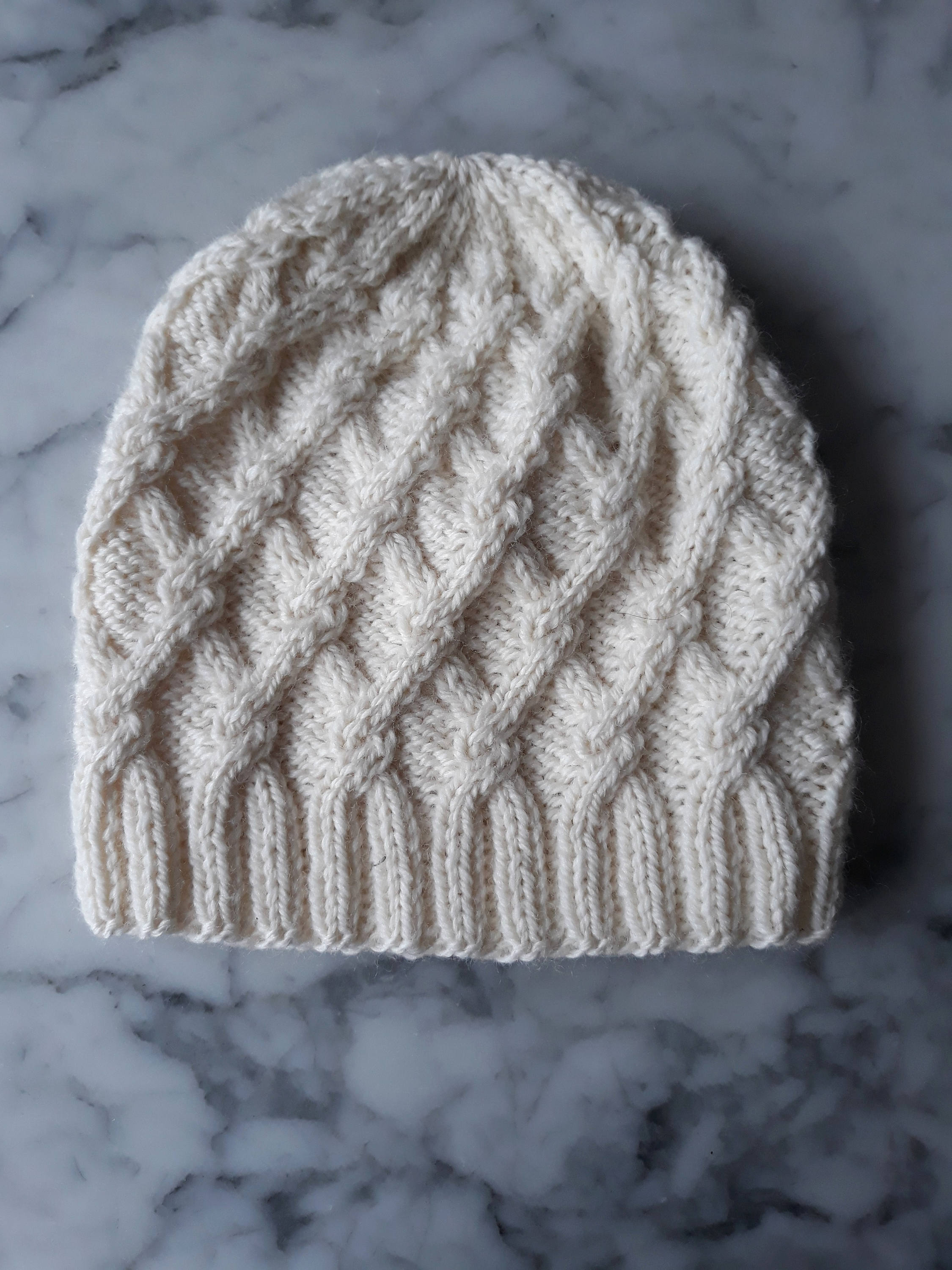 Cable knit beanie: Aran cable hat in traditional cream colour. Wool ...