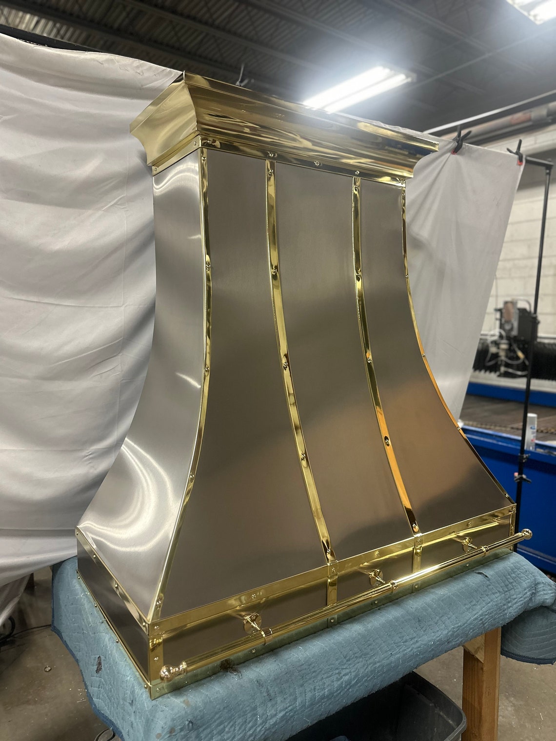 Curved Stainless Steel Range Hood With Polished Brass Strapping ...