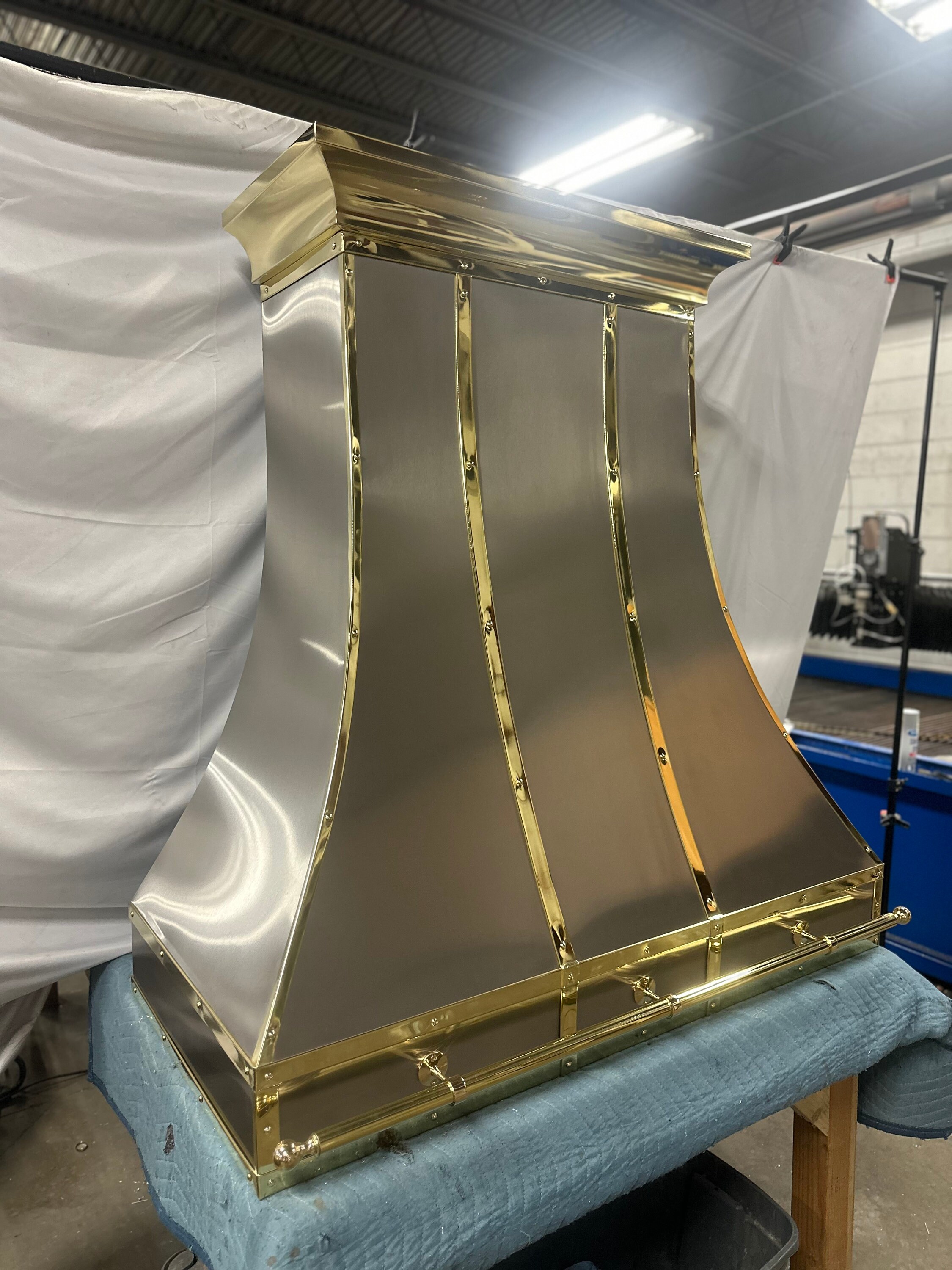 Curved Stainless Steel Range Hood With Polished Brass Strapping ...