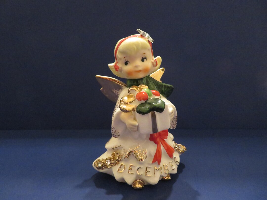 Lefton December Angel Wears a Rhinestone Star on Her Red Ear Muffs ...