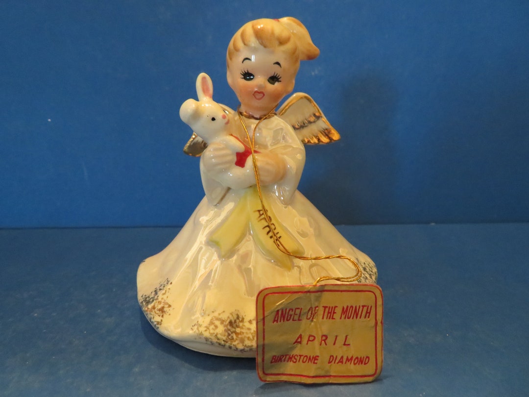 Norcrest April Angel Plays a White Bunny Rabbit Wearing Red Vest ...