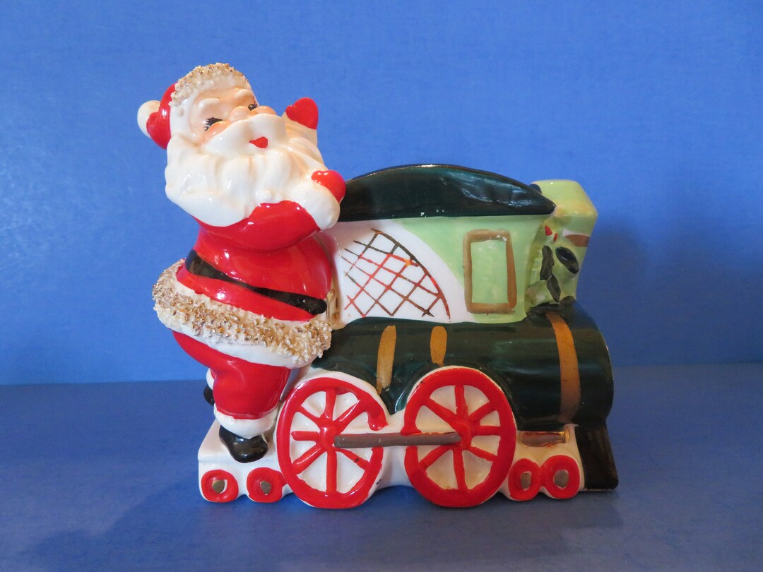 Enesco Santa Rides a Cristmas Train on His Way to Load up Presents and ...