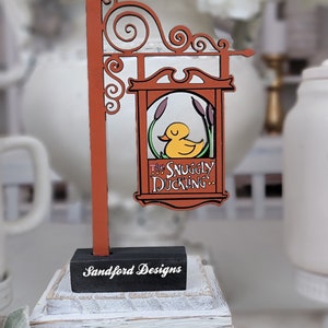Disney Tangled Snuggly Duckling Pub Sign, Snuggly Duckling Self ...