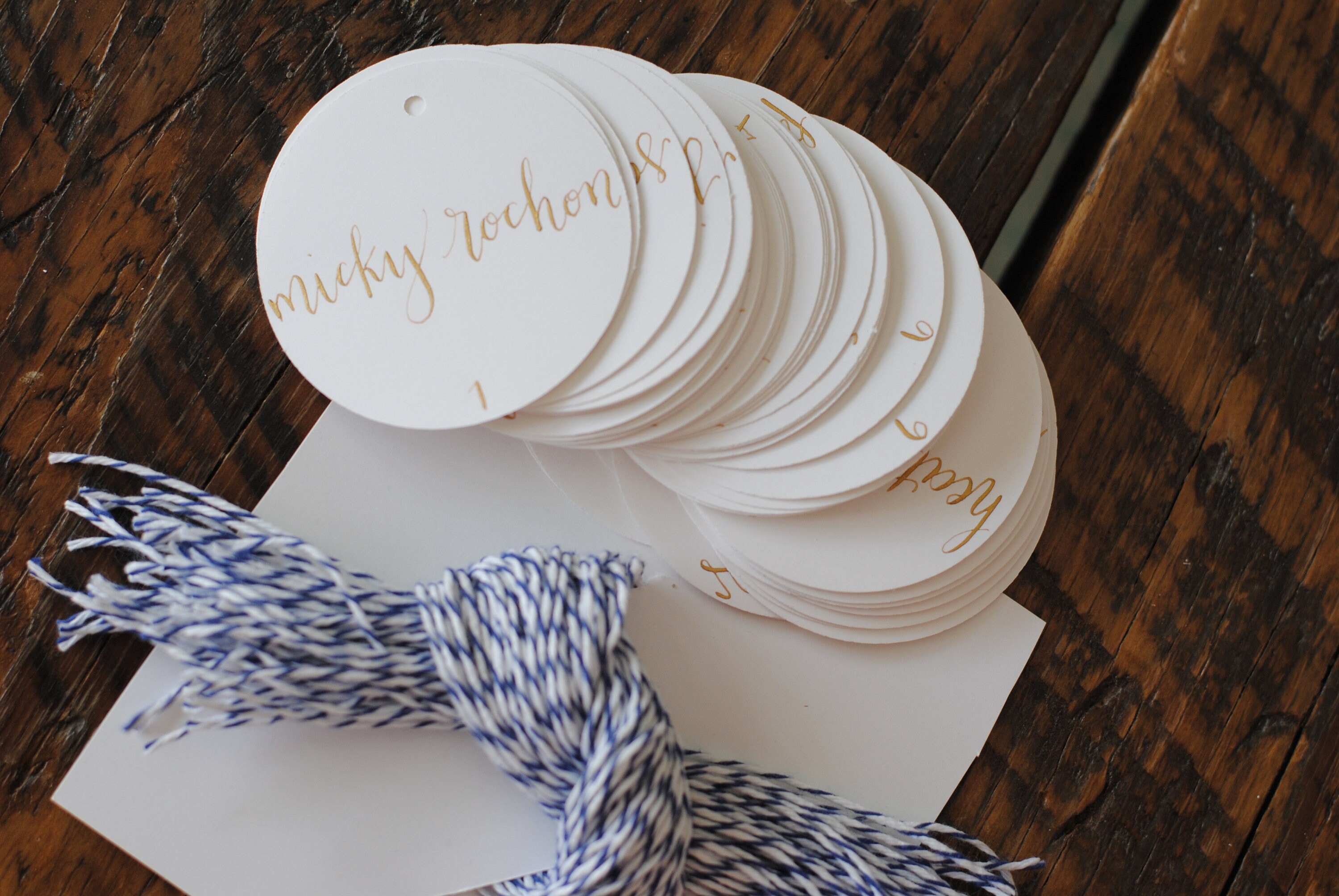Circular Place Cards With Table Numbers - Hand Lettered Escort Cards ...