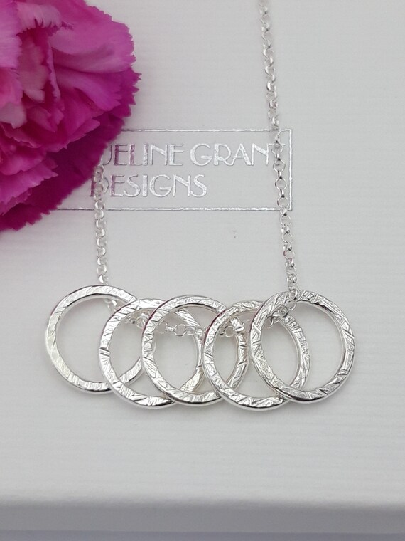 Five rings for five decades necklace store