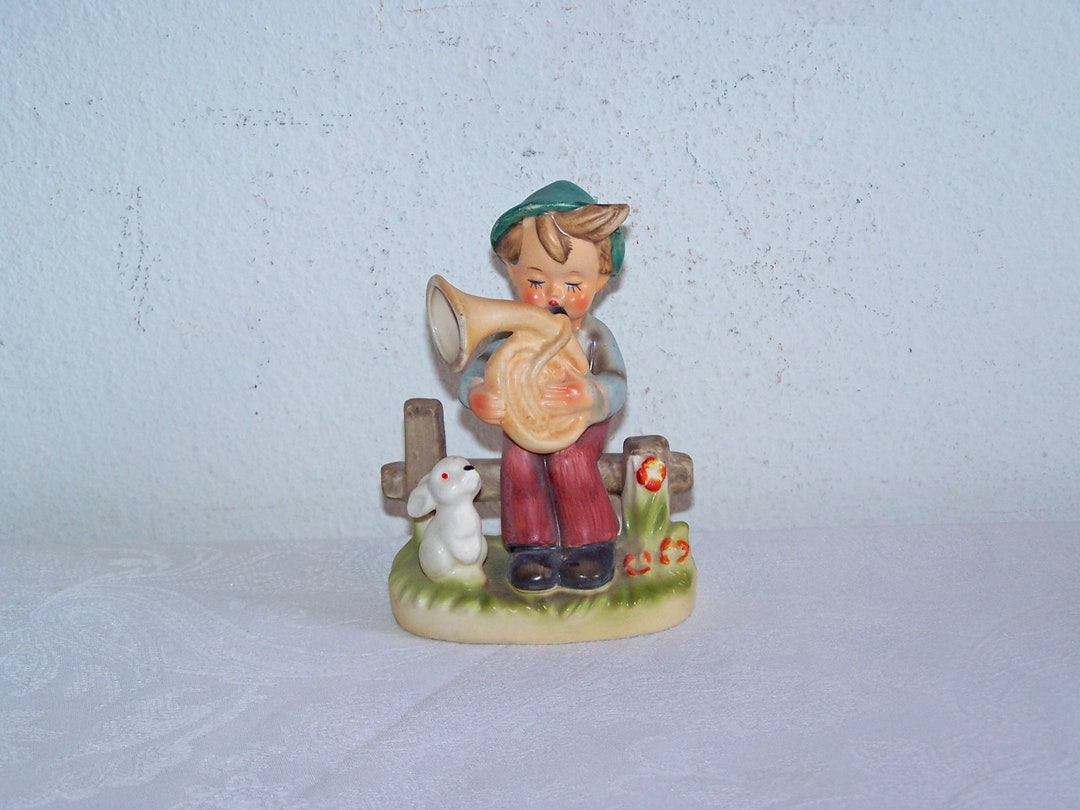 Little Boy Blowing a Big Tuba, With Cute Rabbit Listening, Napcoware ...