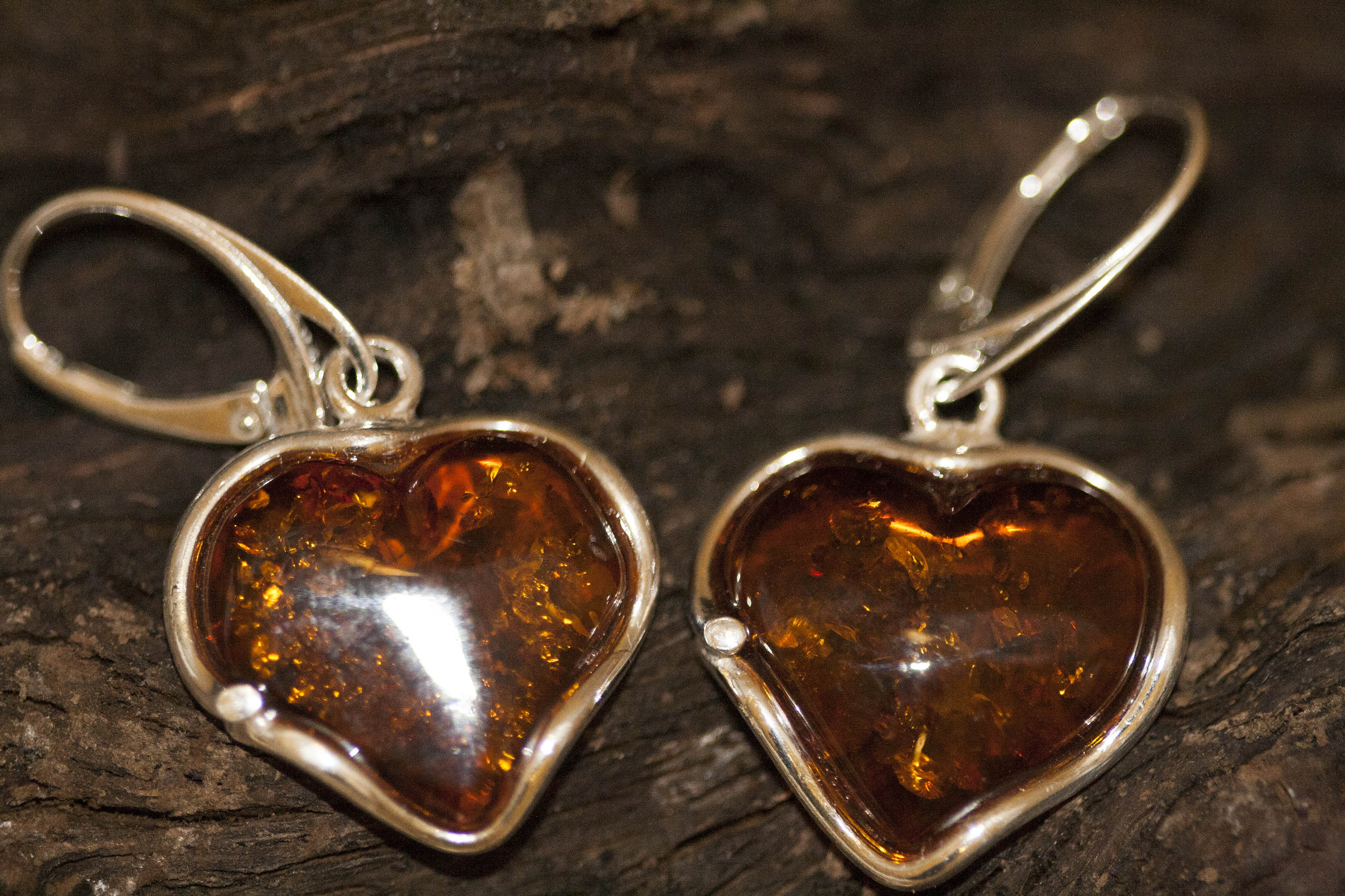 Heart shaped amber earrings fitted in a Sterling Silver setting ...