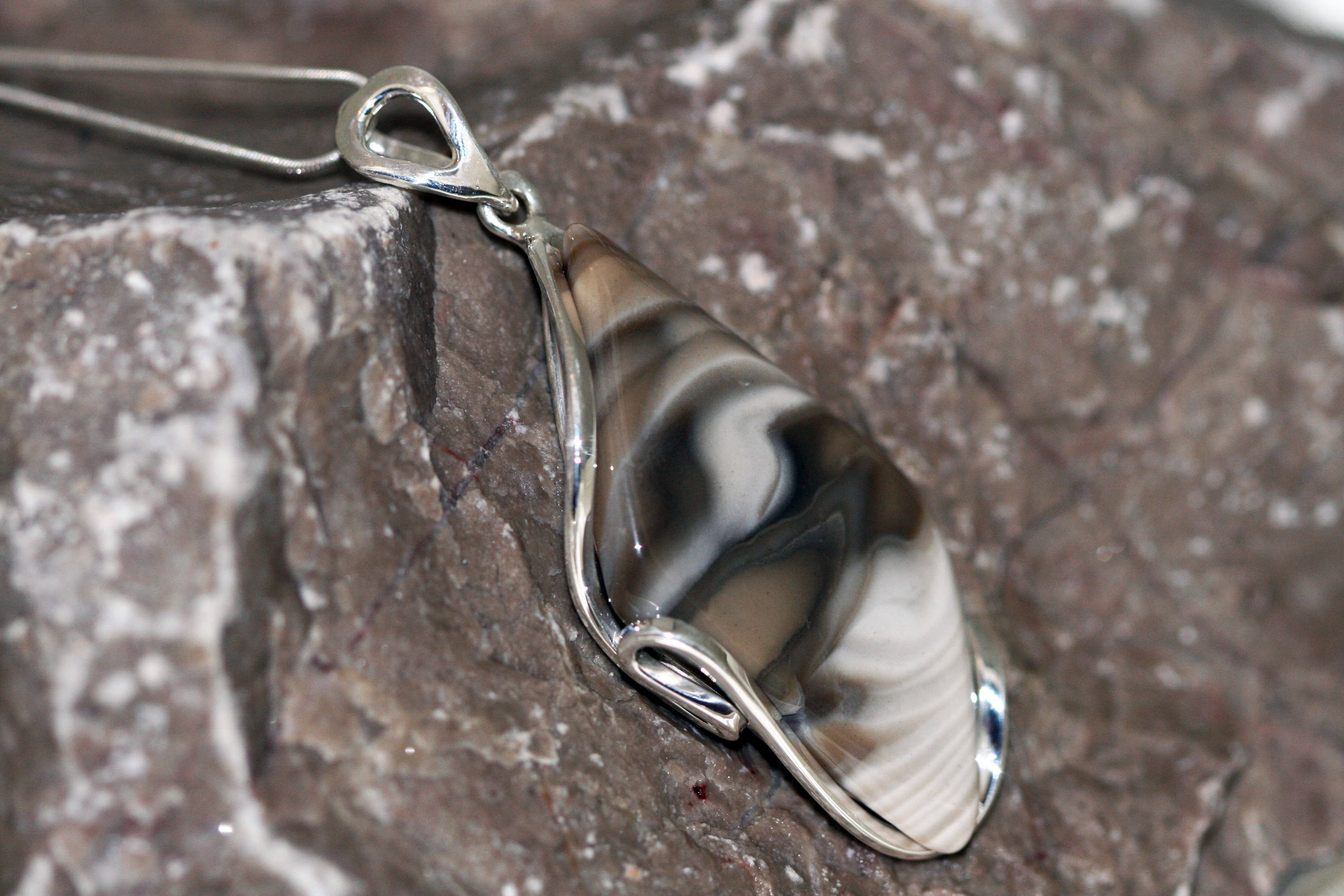 Striped Flint pendant fitted in sterling silver setting.