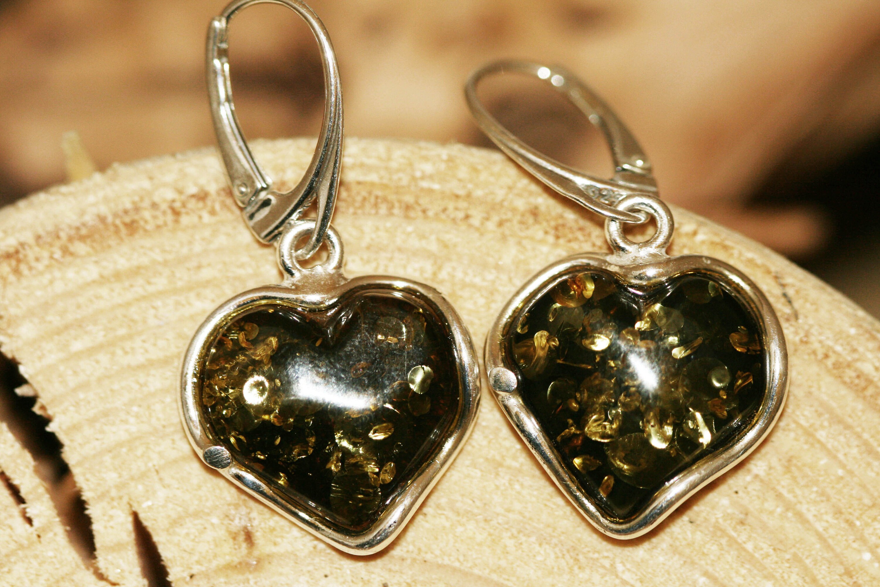 Heart shaped amber earrings fitted in a Sterling Silver setting ...