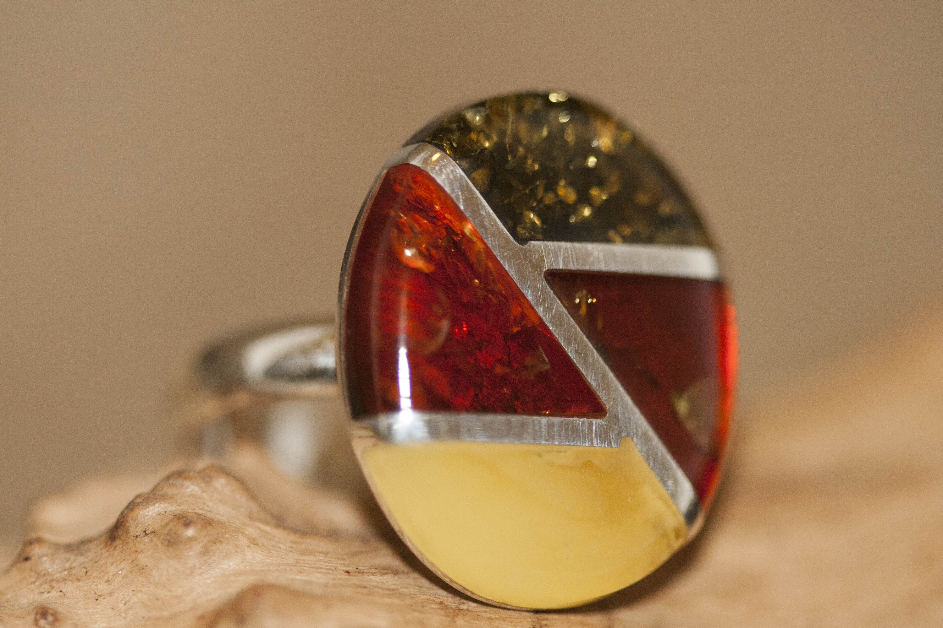 Large Baltic amber ring. Three kinds of amber shades fitted in sterling ...