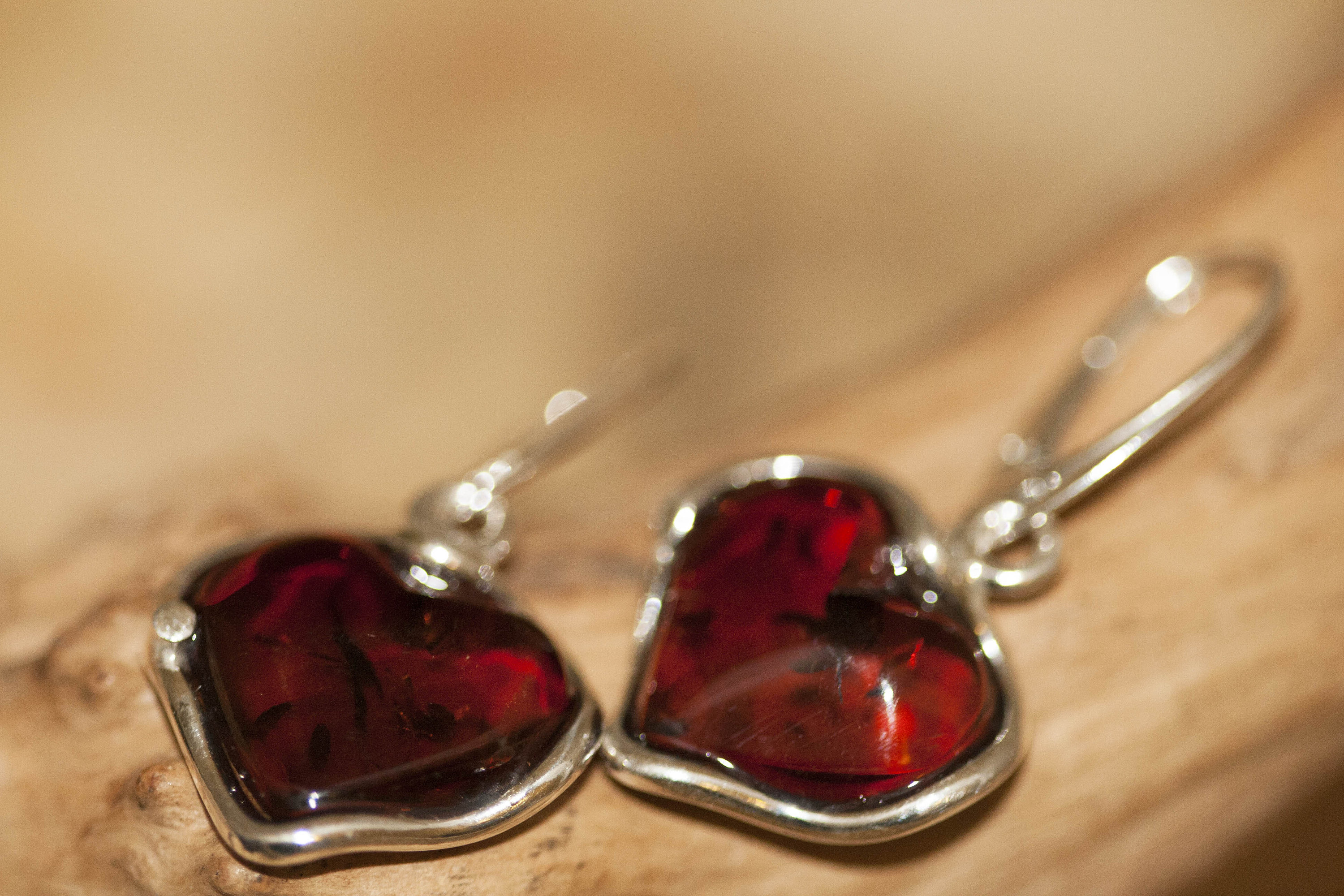 Heart shaped amber earrings fitted in a Sterling Silver setting ...