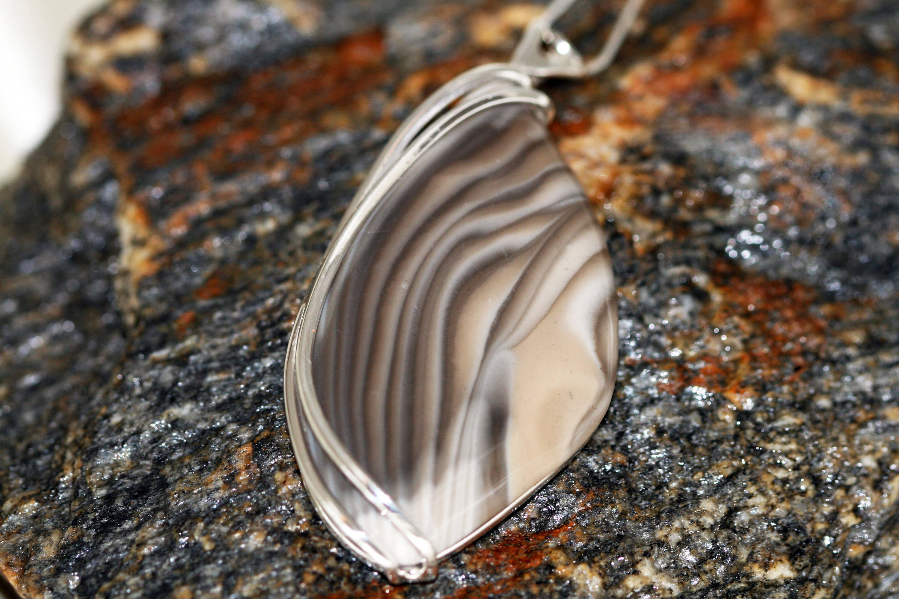 Striped Flint pendant fitted in sterling silver setting.