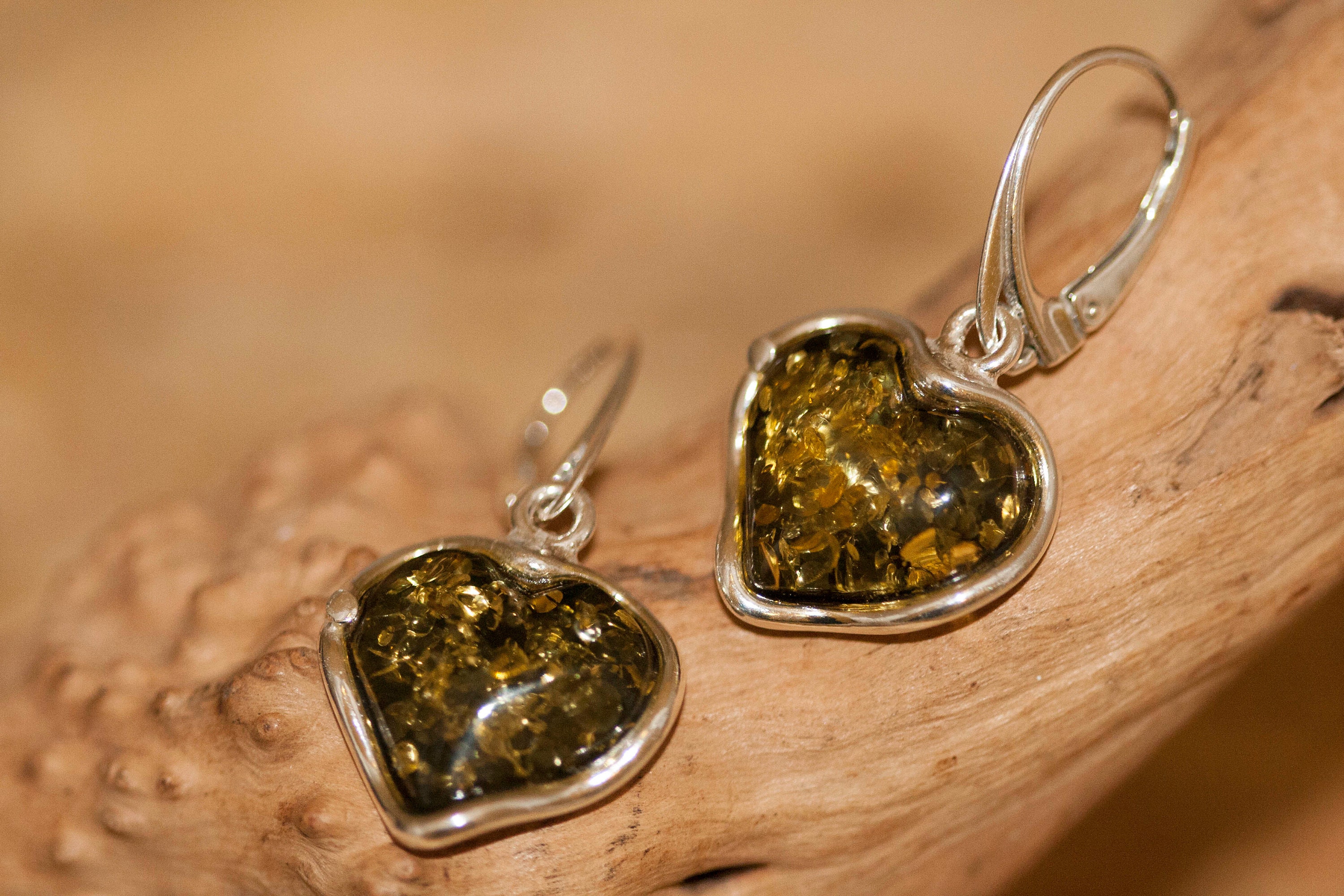 Heart shaped amber earrings fitted in a Sterling Silver setting ...